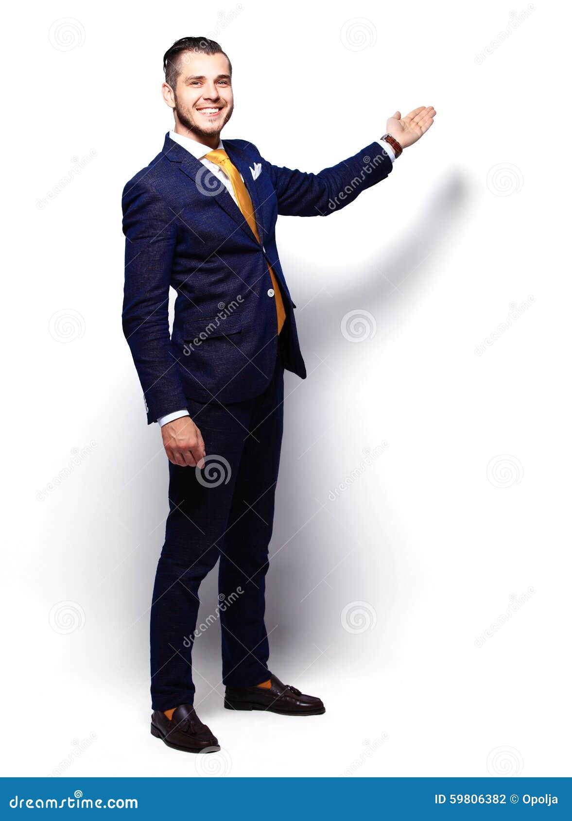 Happy Young Businessman Presenting Isolated Over White Stock Photo ...