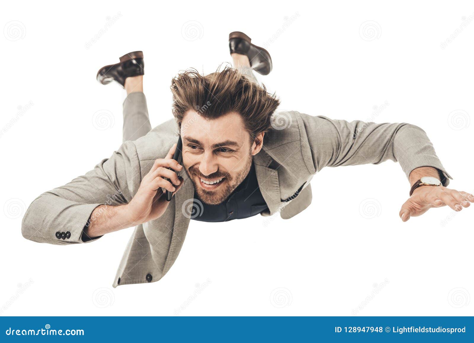 Happy Young Businessman Talking by Phone while Falling Stock Photo ...