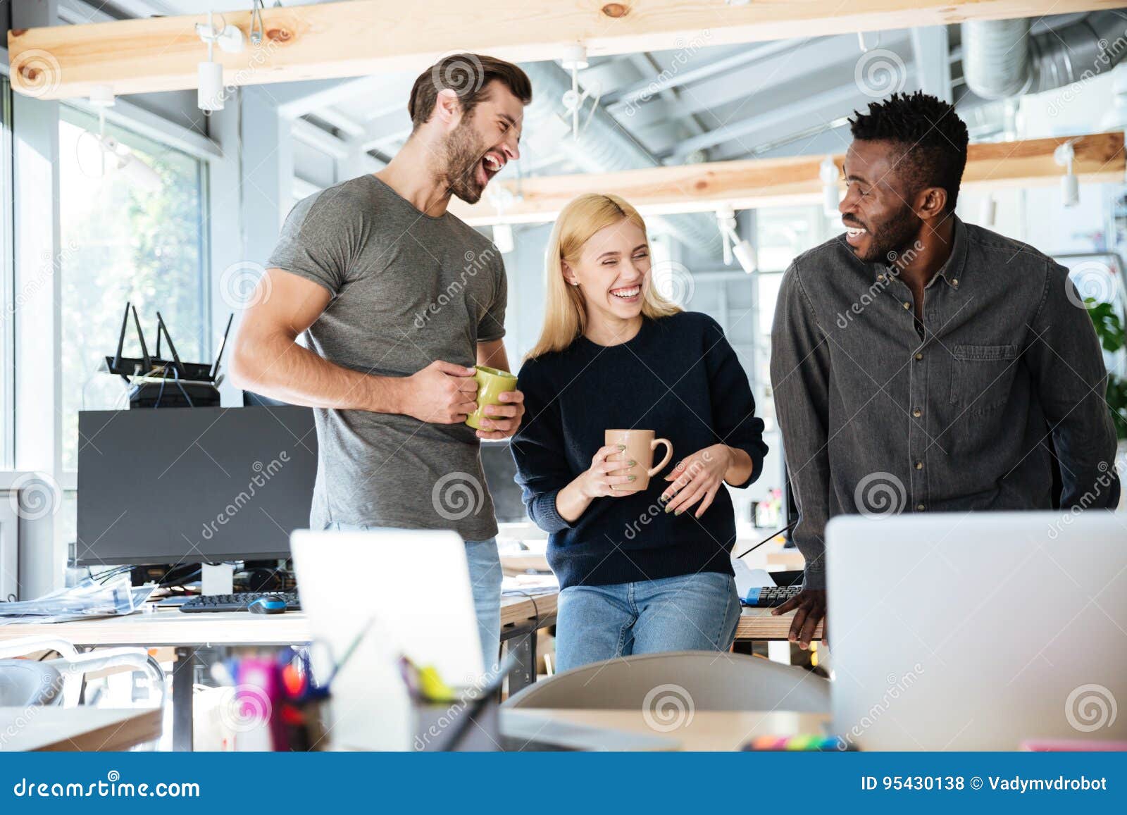 Happy Young Colleagues Talking with Each Other. Stock Photo - Image of ...