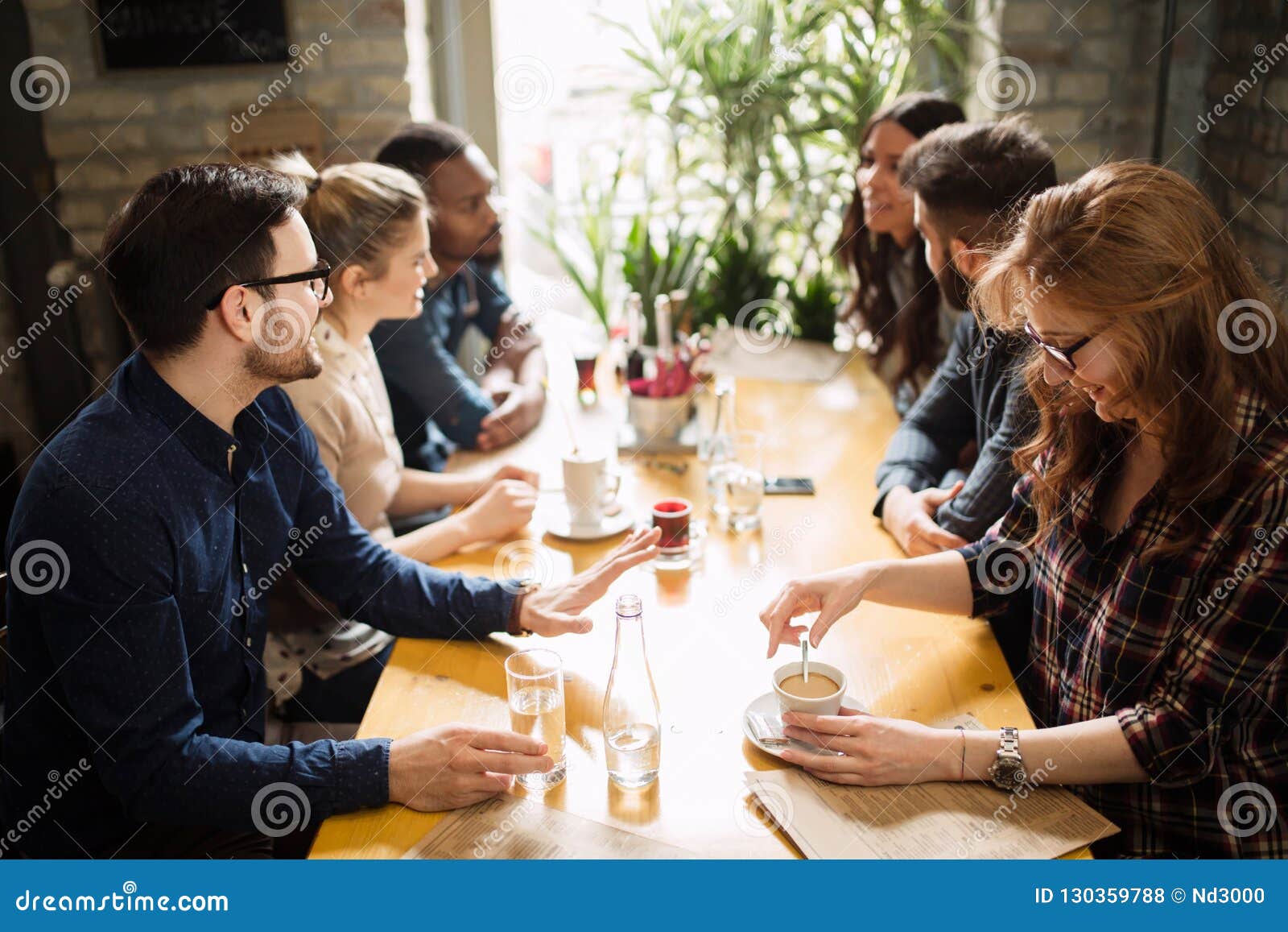 Happy Colleagues from Work Socializing in Restaurant Stock Photo ... Happy Colleagues from Work Socializing in Restaurant Stock Photo ...