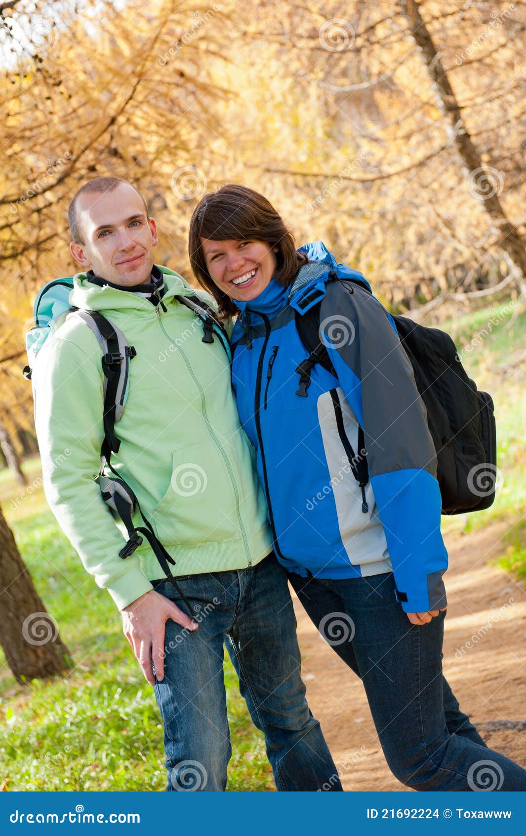 Happy Young Couple with Backpacks in the Park Stock Photo - Image of ...