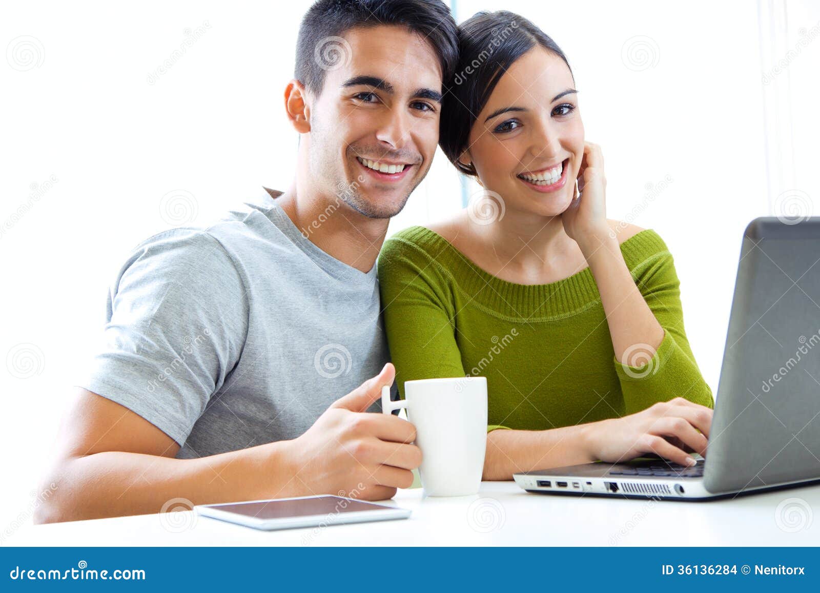 Happy Young Couple Browsing Internet at Home Stock Photo - Image of ...