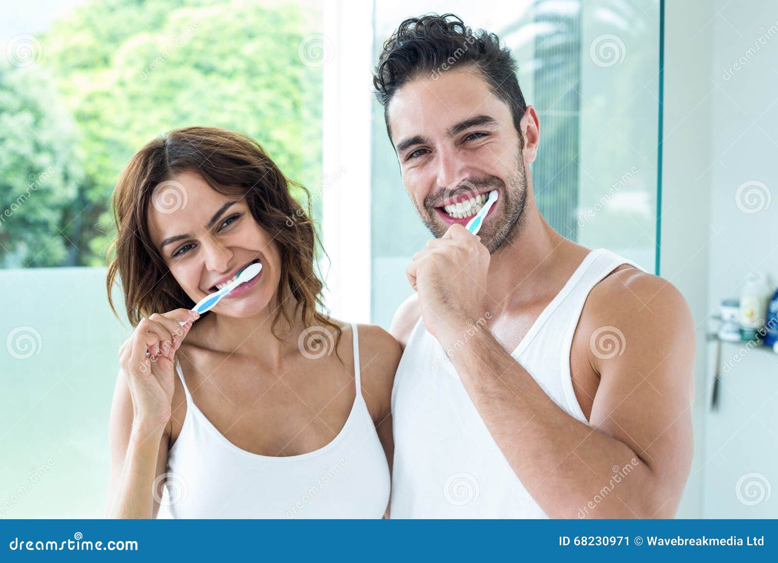 Happy Young Couple Brushing Teeth Stock Image - Image of camera ...