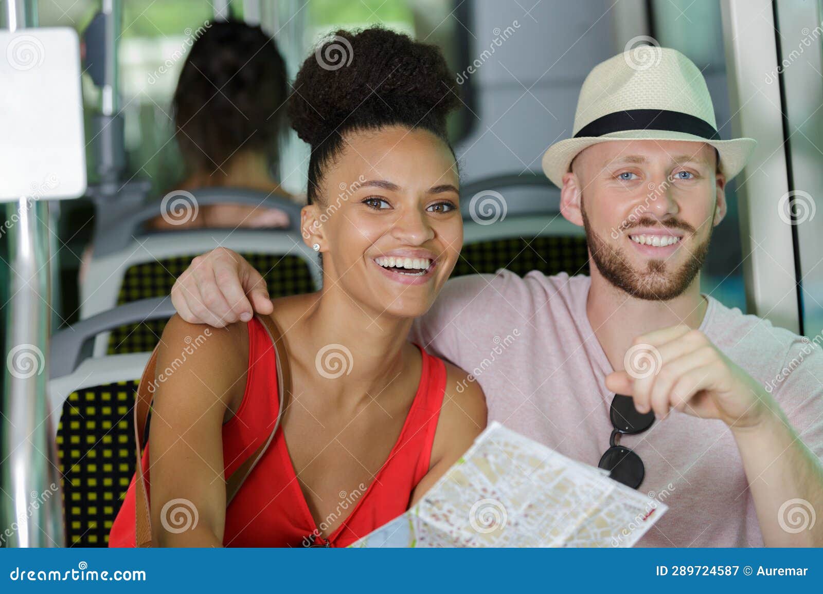 Happy young couple in bus stock image. Image of female - 289724587