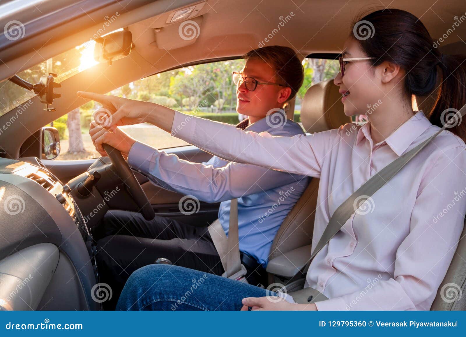 Happy Young Couple in Car while Driving a Car, Driving Car Concept ...
