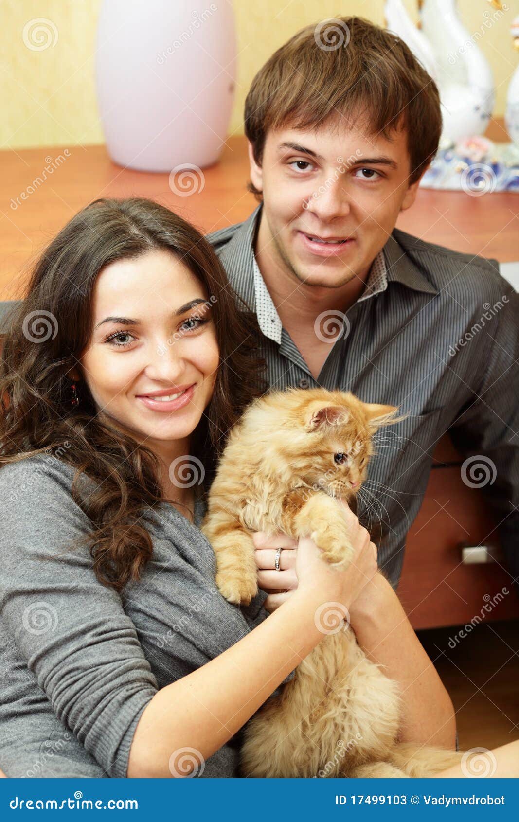 Happy Young Couple with a Cat Stock Image - Image of home, young: 17499103