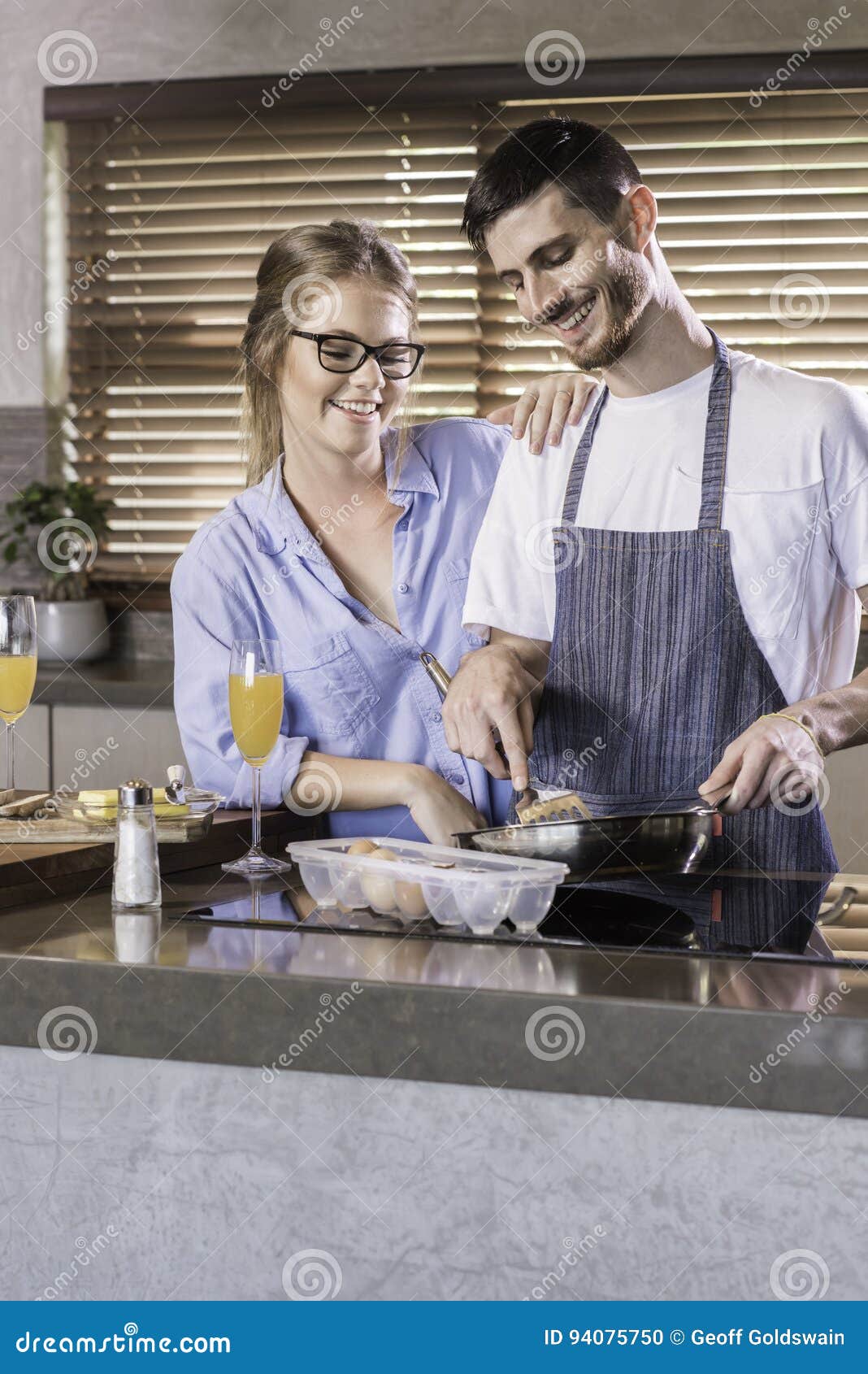 Happy Young Couple Cooking Breakfast Preparing in the Kitchen Stock ...