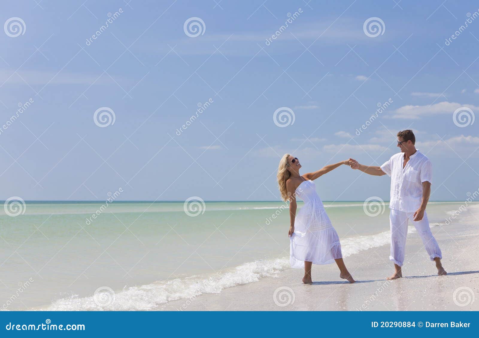 Happy Young Couple Dancing Holding Hands on Beach Stock Photo - Image ...
