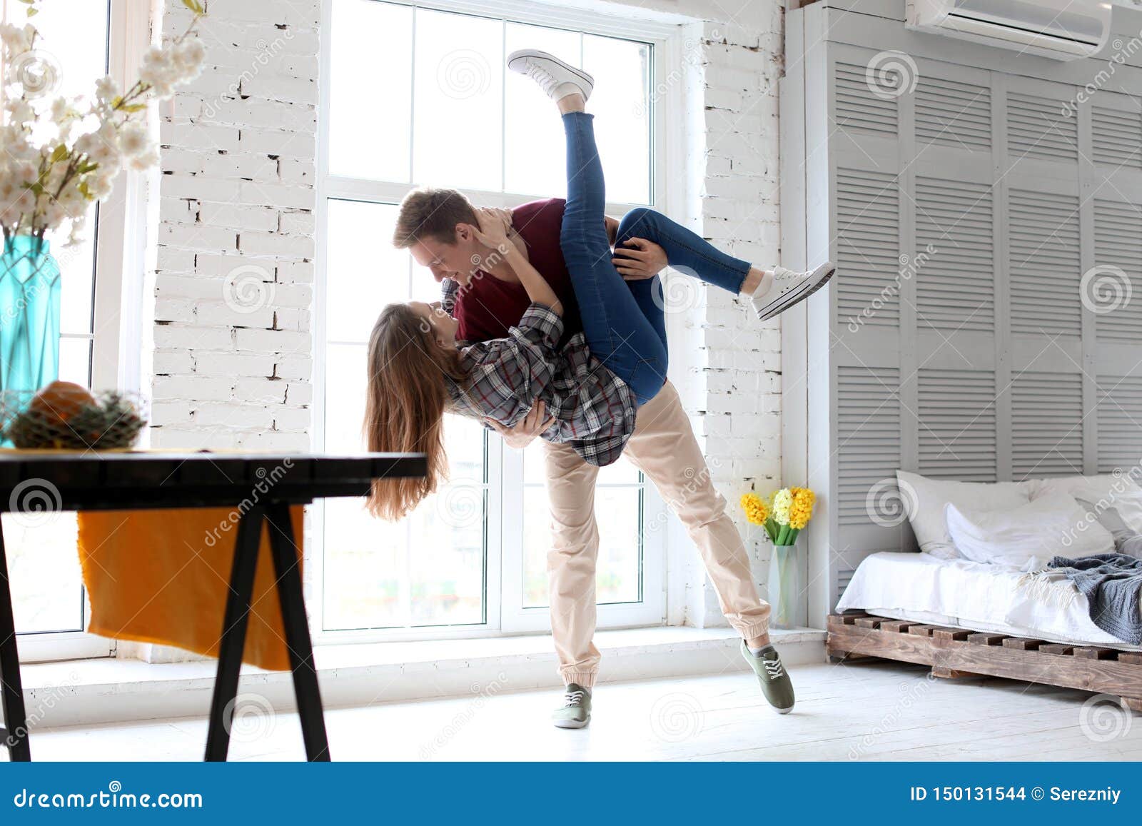 Happy Young Couple Dancing at Home Stock Photo - Image of feelings ...