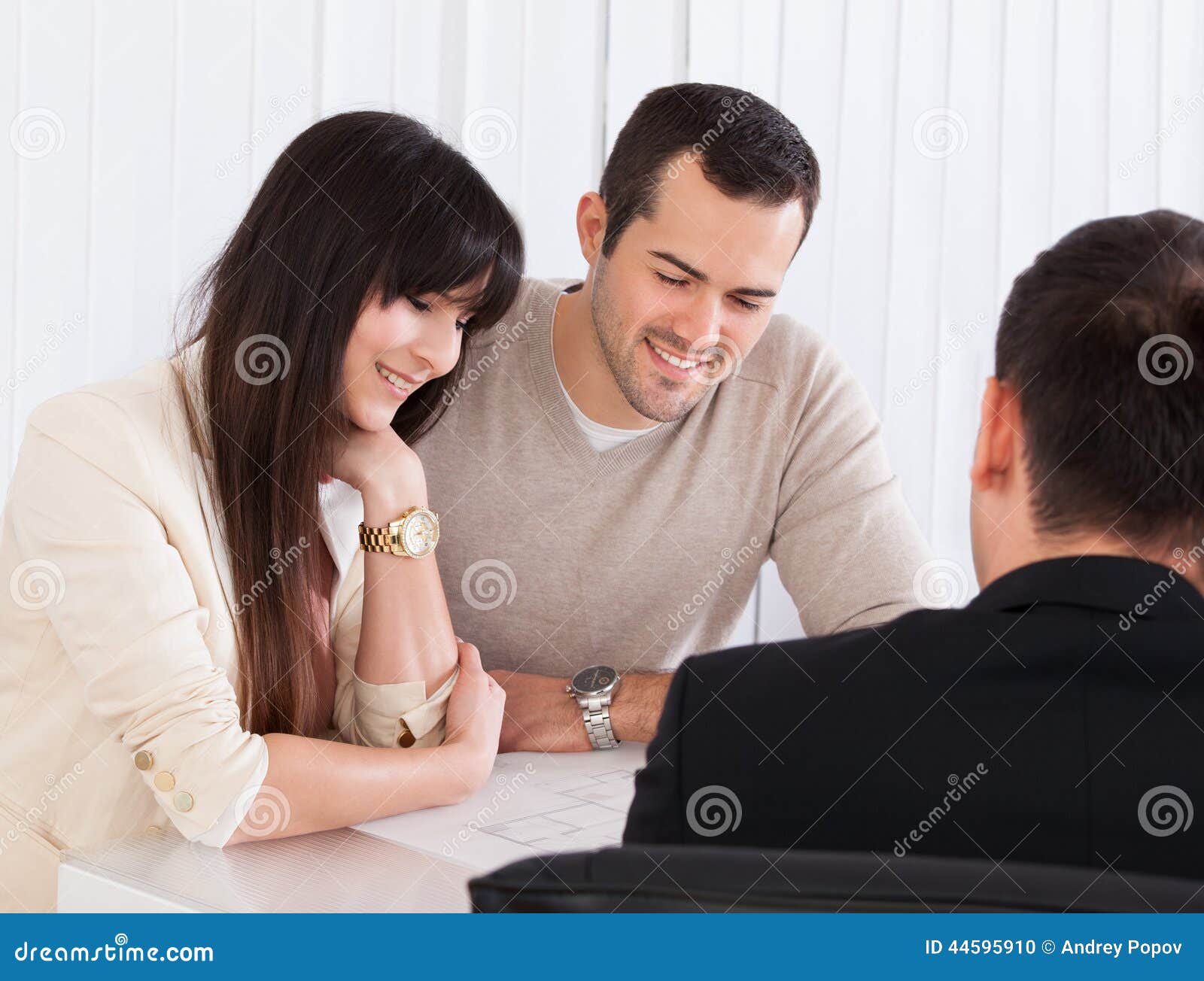 Happy Young Couple Discussing with Consultant Stock Photo - Image of ...