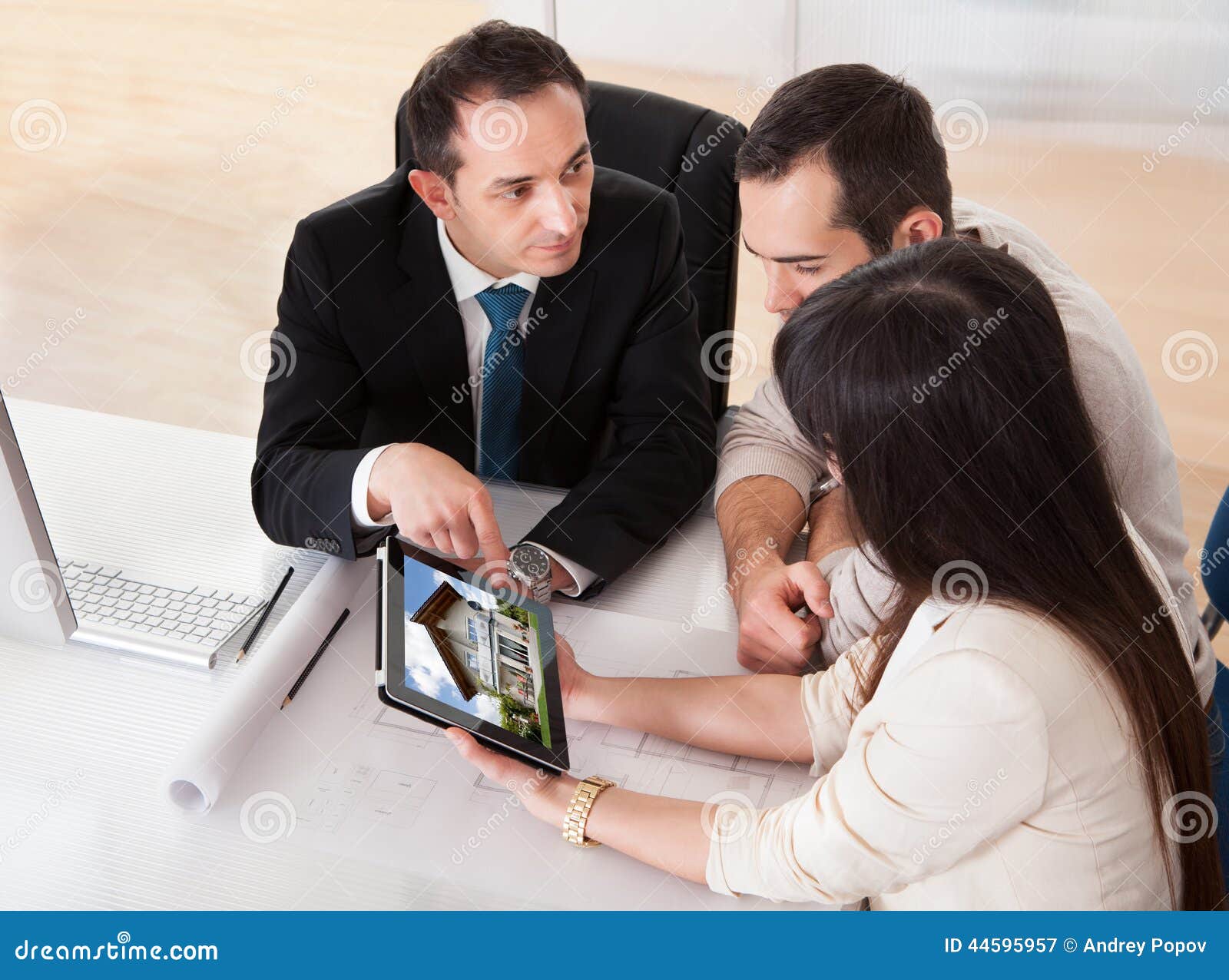 Happy Young Couple Discussing with Consultant Stock Image - Image of ...