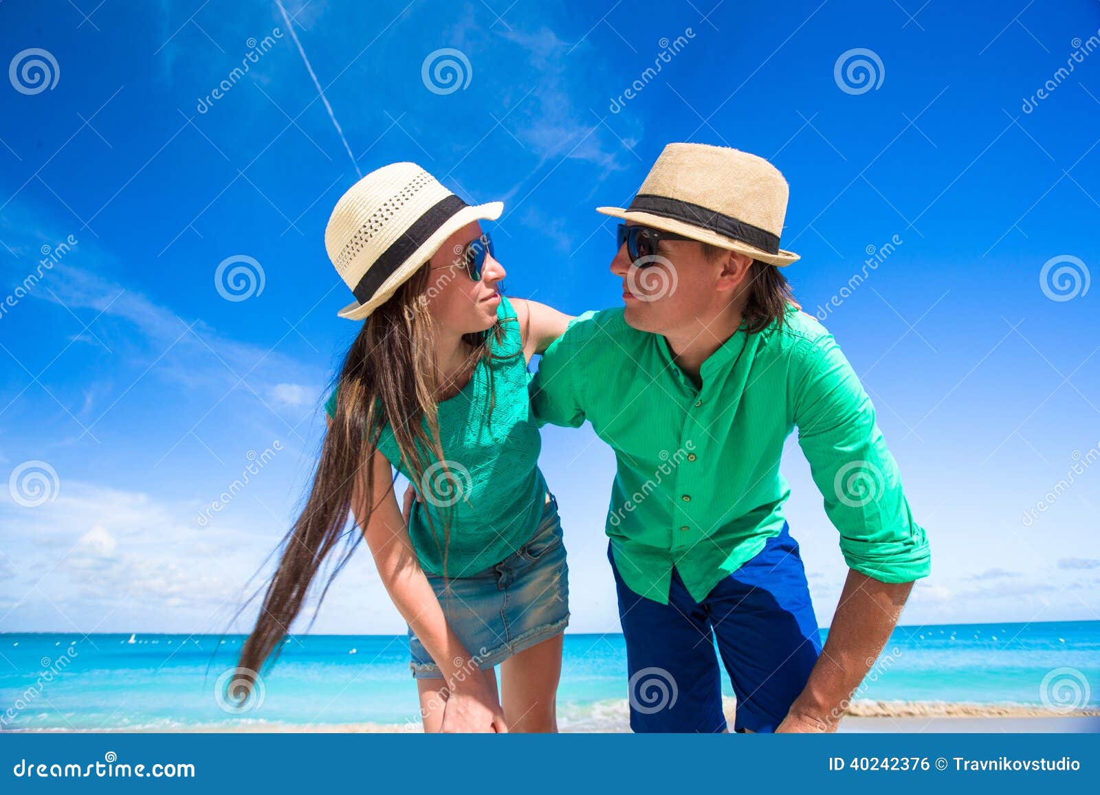 Happy Young Couple on Exotic Beach Looking at Camera Stock Photo ...