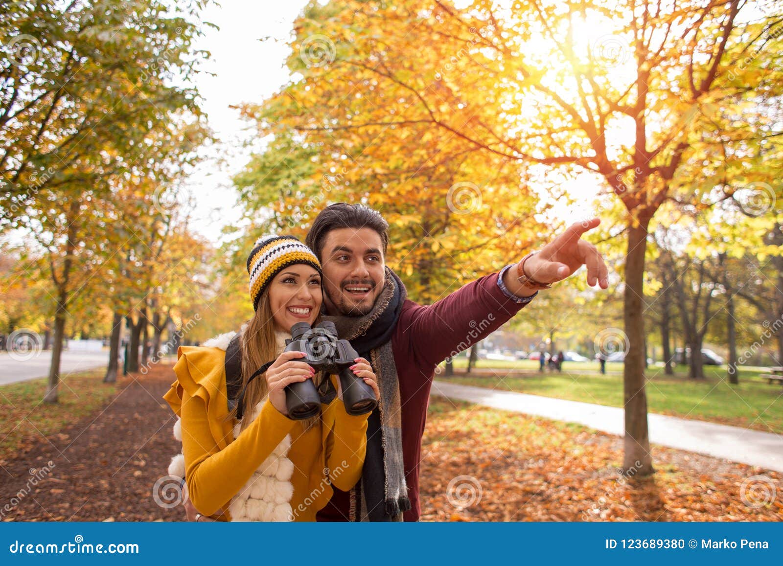 Happy Young Couple Exploring in Autumn at the Park Stock Photo - Image ...