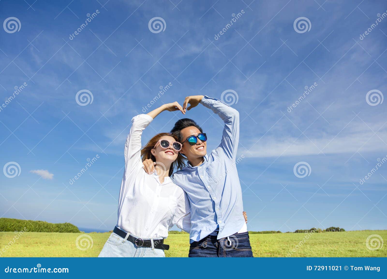 Happy Young Couple Forming Love Shape Stock Image - Image of heart ...