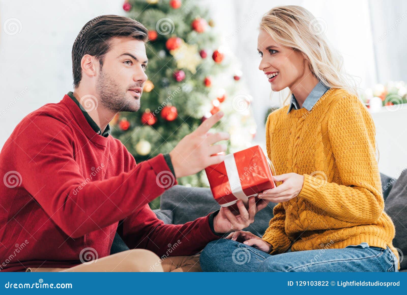 Happy Young Couple Gifting Present at Home Stock Photo - Image of ...