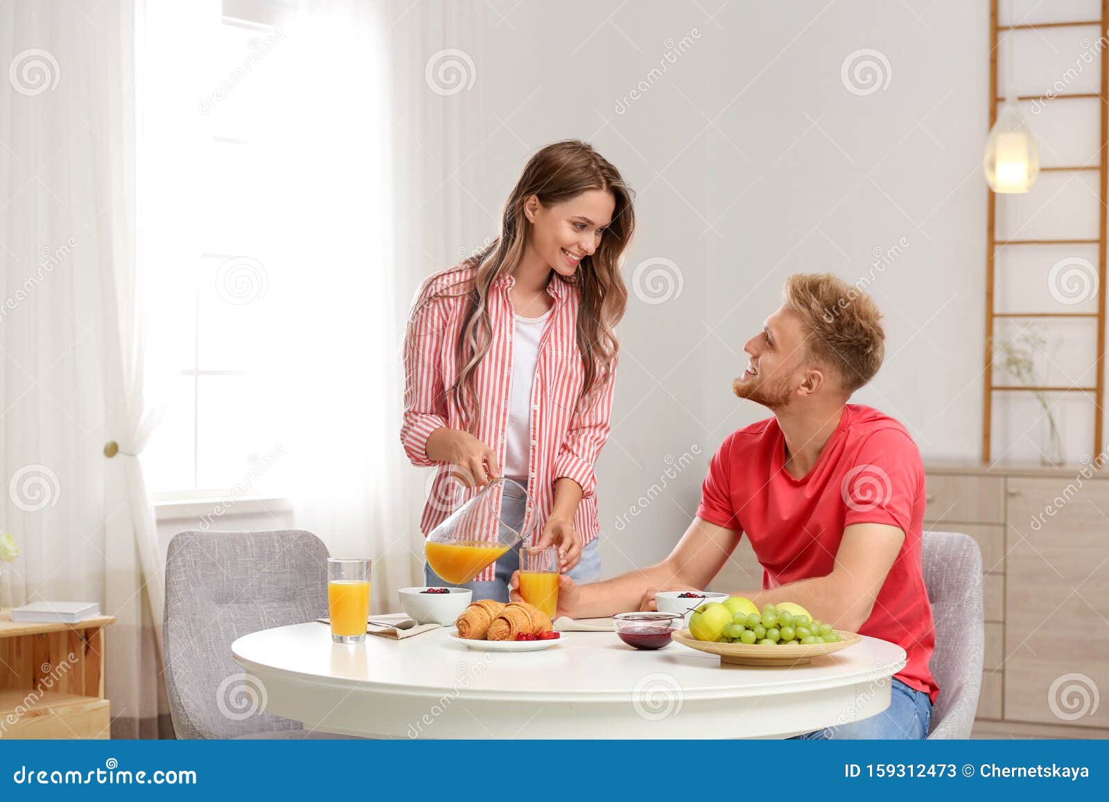 Happy Young Couple Having Breakfast at Table Stock Image - Image of ...