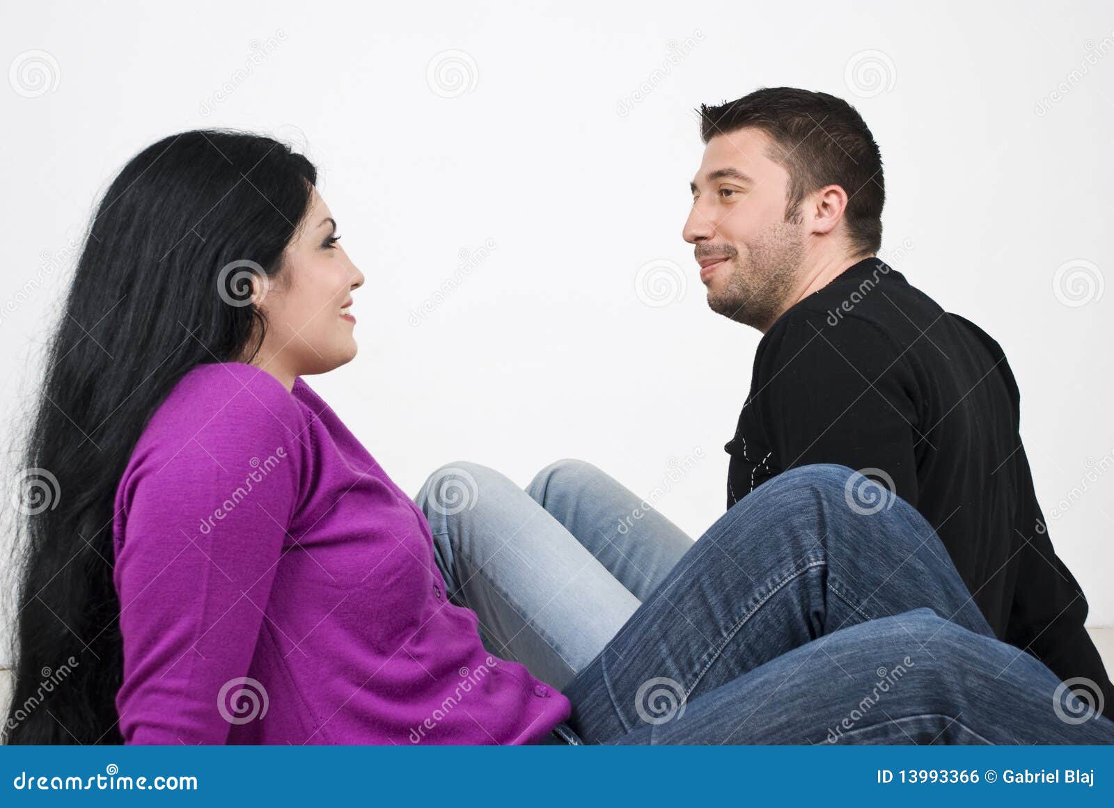 Happy Young Couple Having a Conversation Stock Photo - Image of ...