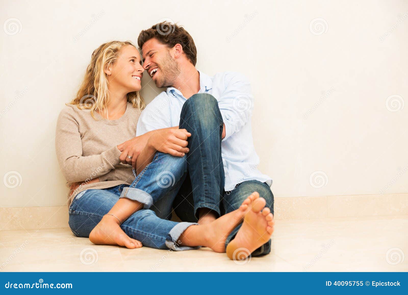 Happy young couple at home stock image. Image of interior - 40095755