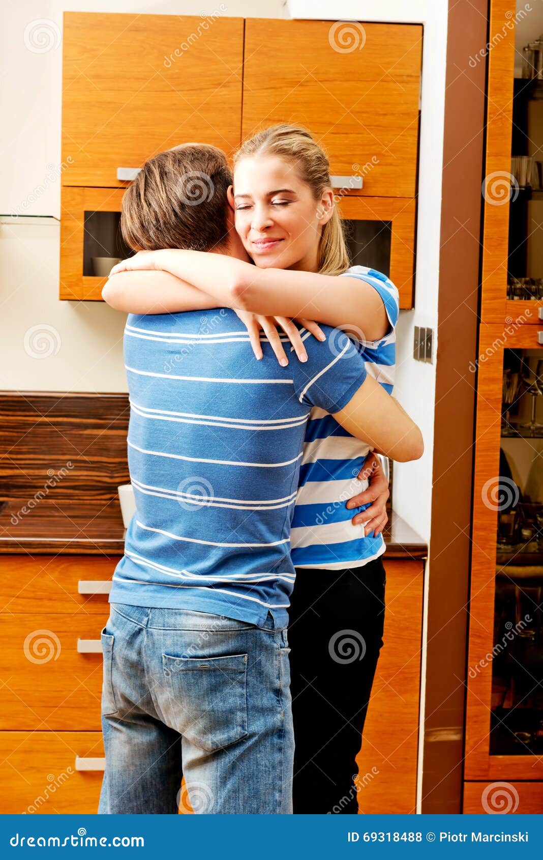 Happy Young Couple Hugging in the Kitchen Stock Photo - Image of female ...