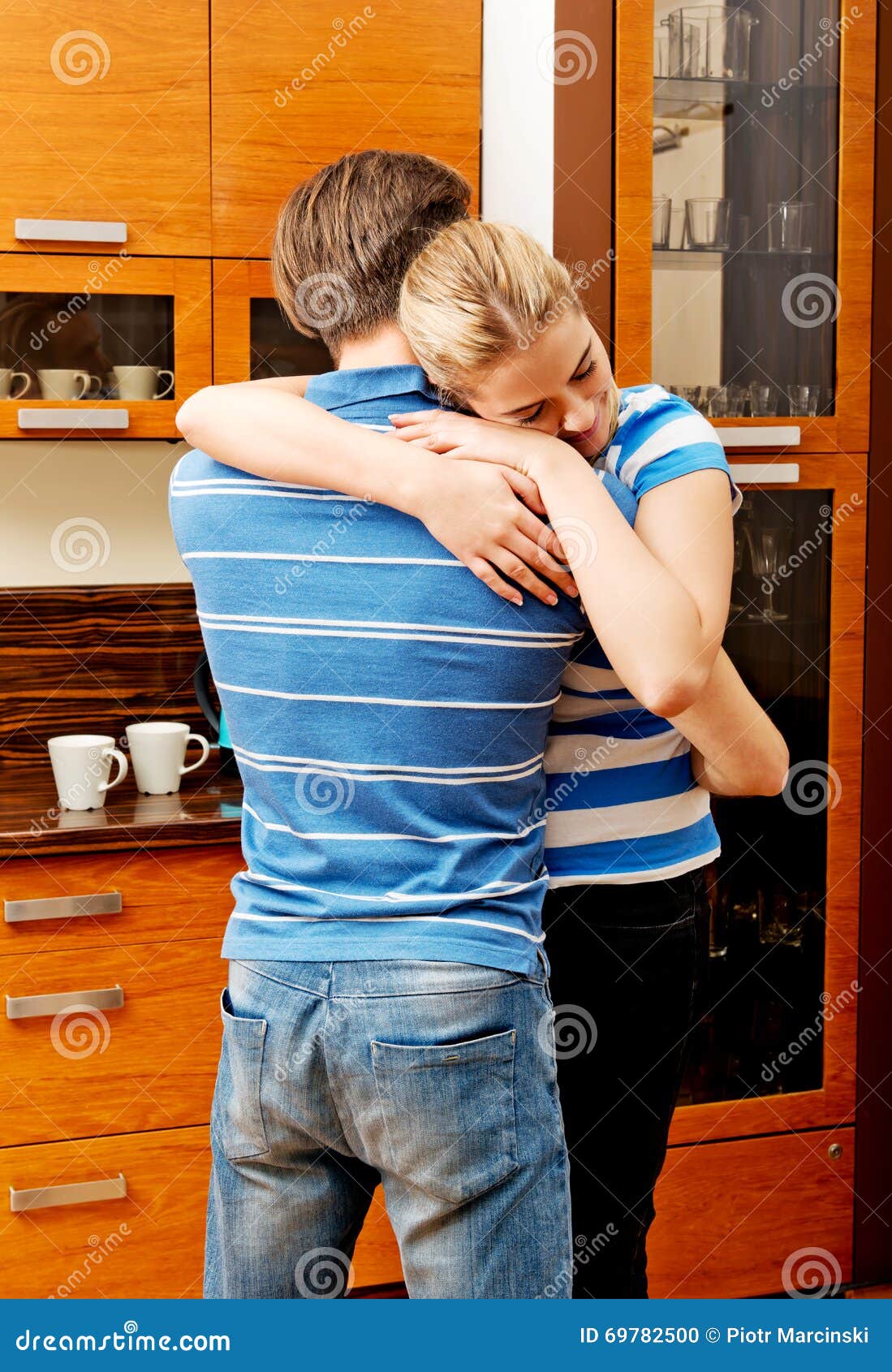 Happy Young Couple Hugging in the Kitchen Stock Photo - Image of ...