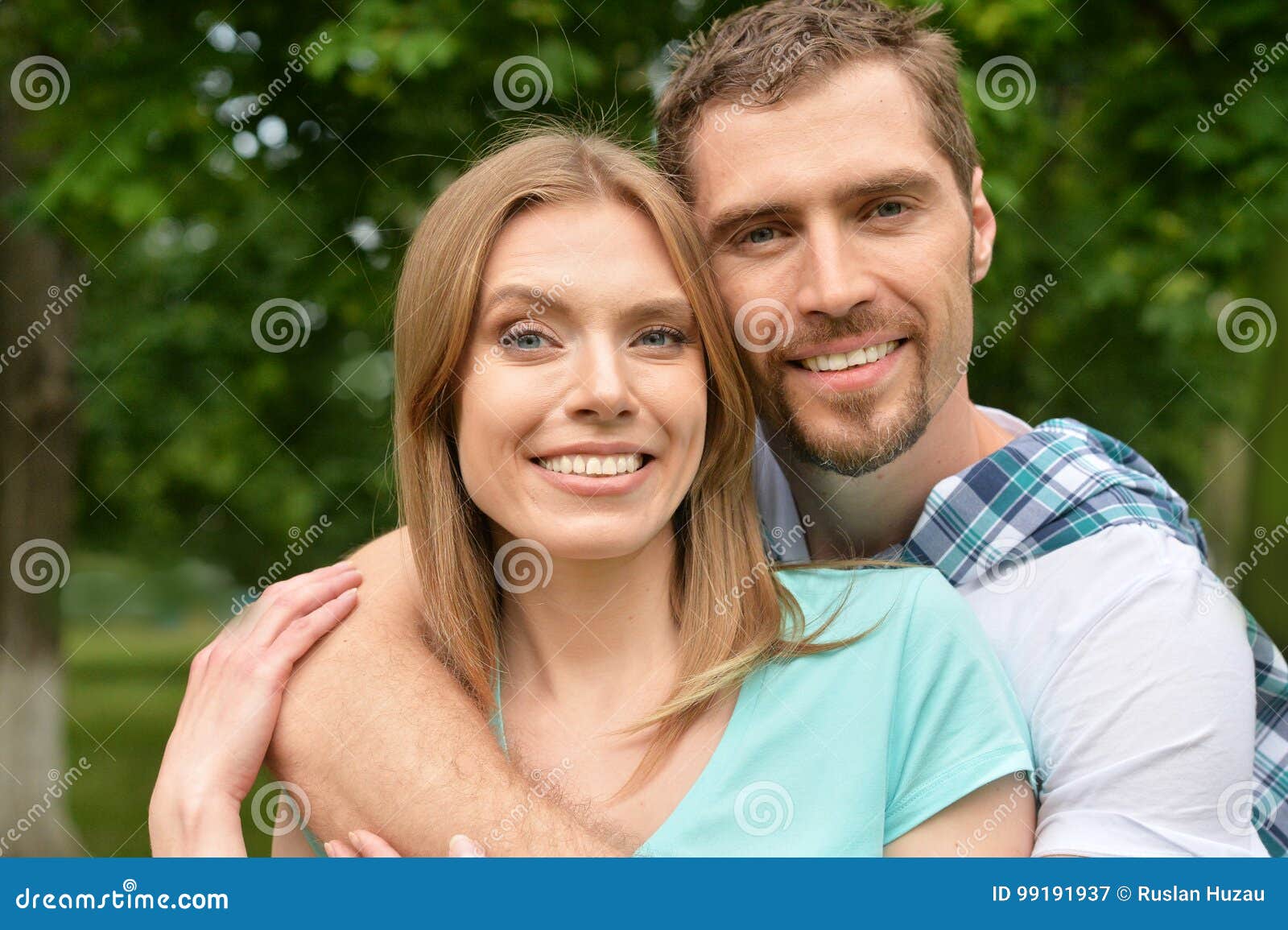 Happy young couple hugging stock image. Image of pretty - 99191937
