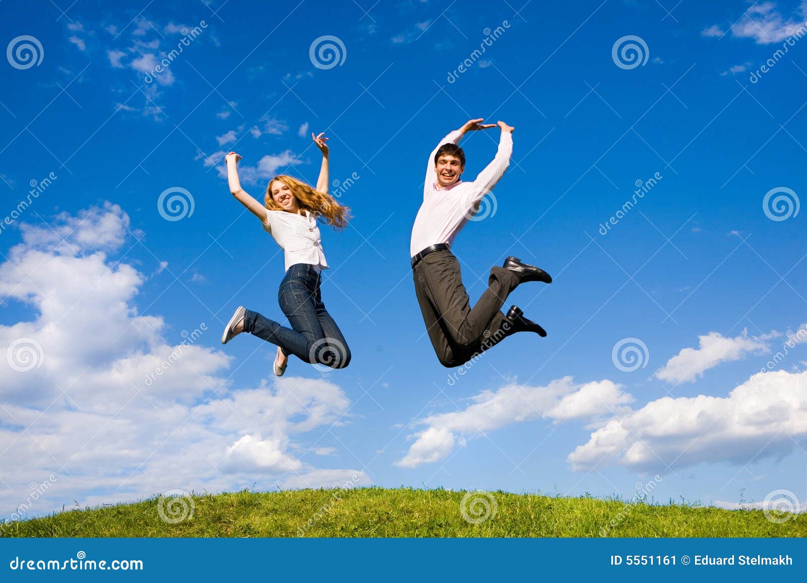 Happy Young Couple jumping stock image. Image of green - 5551161