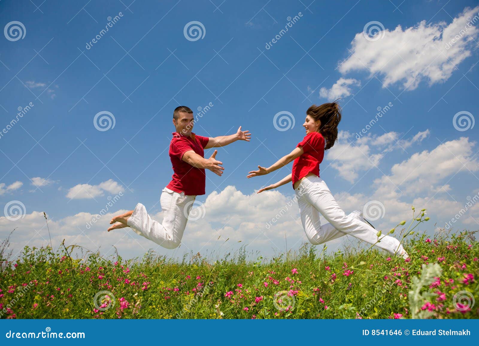 Happy Young Couple jumping stock photo. Image of spring - 8541646