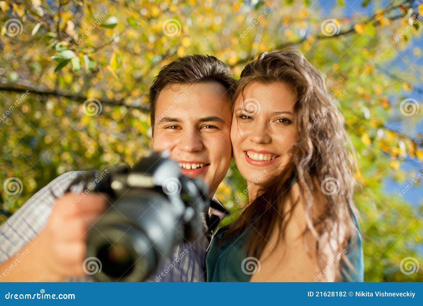 Happy Young Couple Looking at Camera Stock Photo - Image of women ...