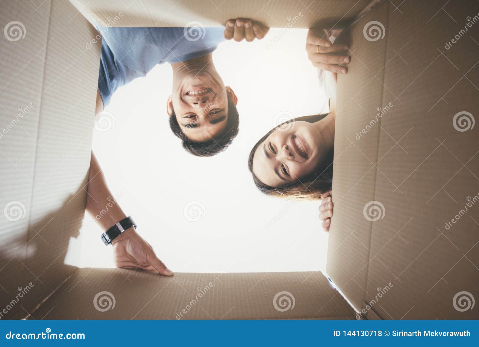 Happy Young Couple Looking Inside the Box. Stock Photo - Image of ...