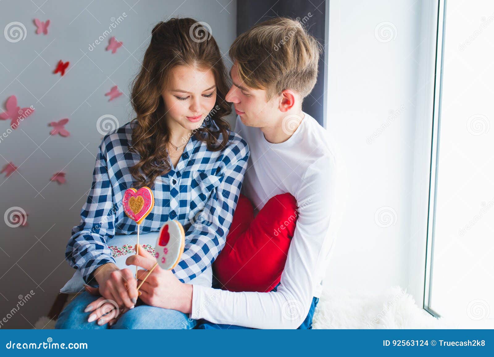 Happy Young Couple In Love Close To Each Other Tenderly Kissing Stock