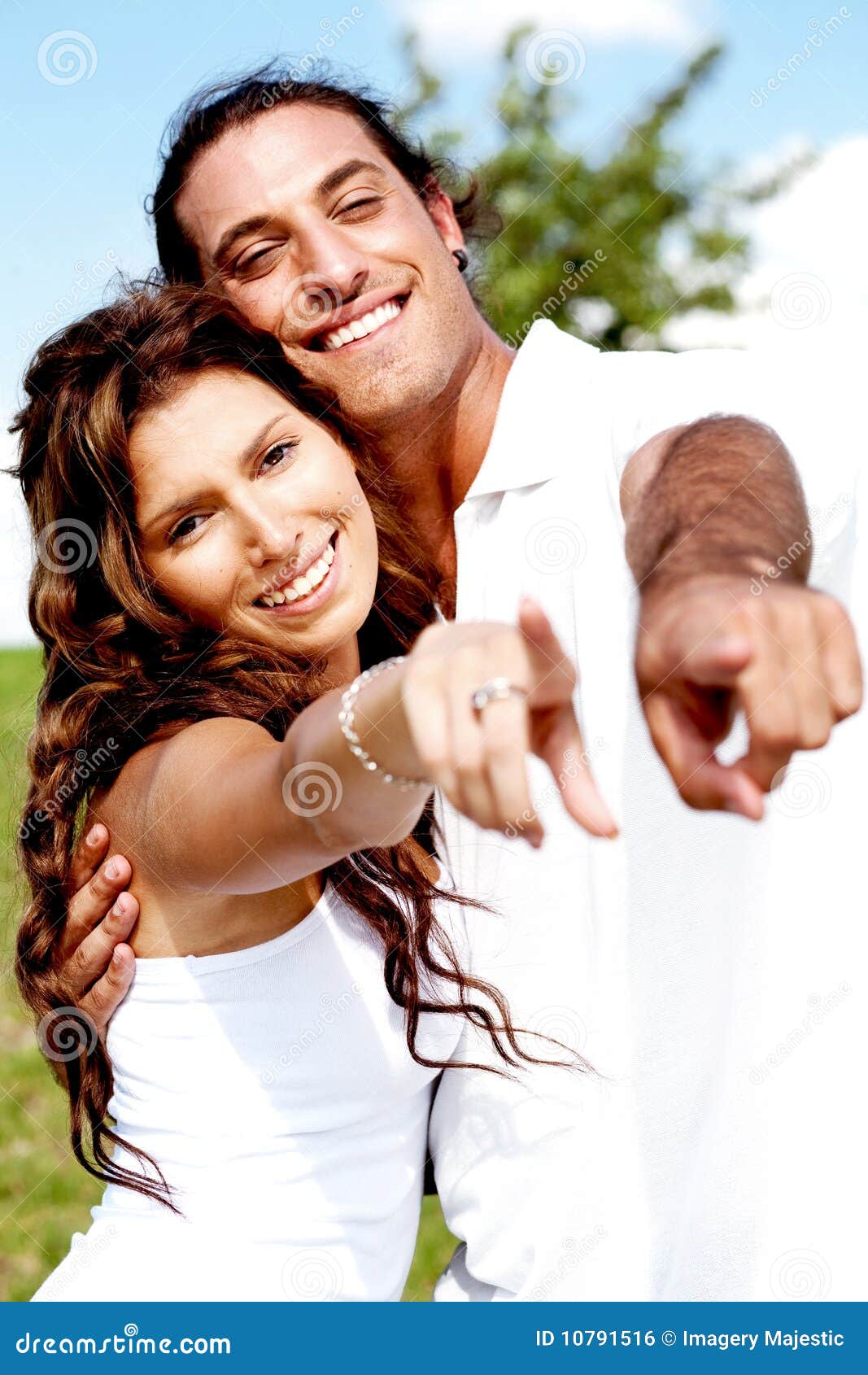Happy Young Couple Pointing Stock Photo - Image of gorgeous ...