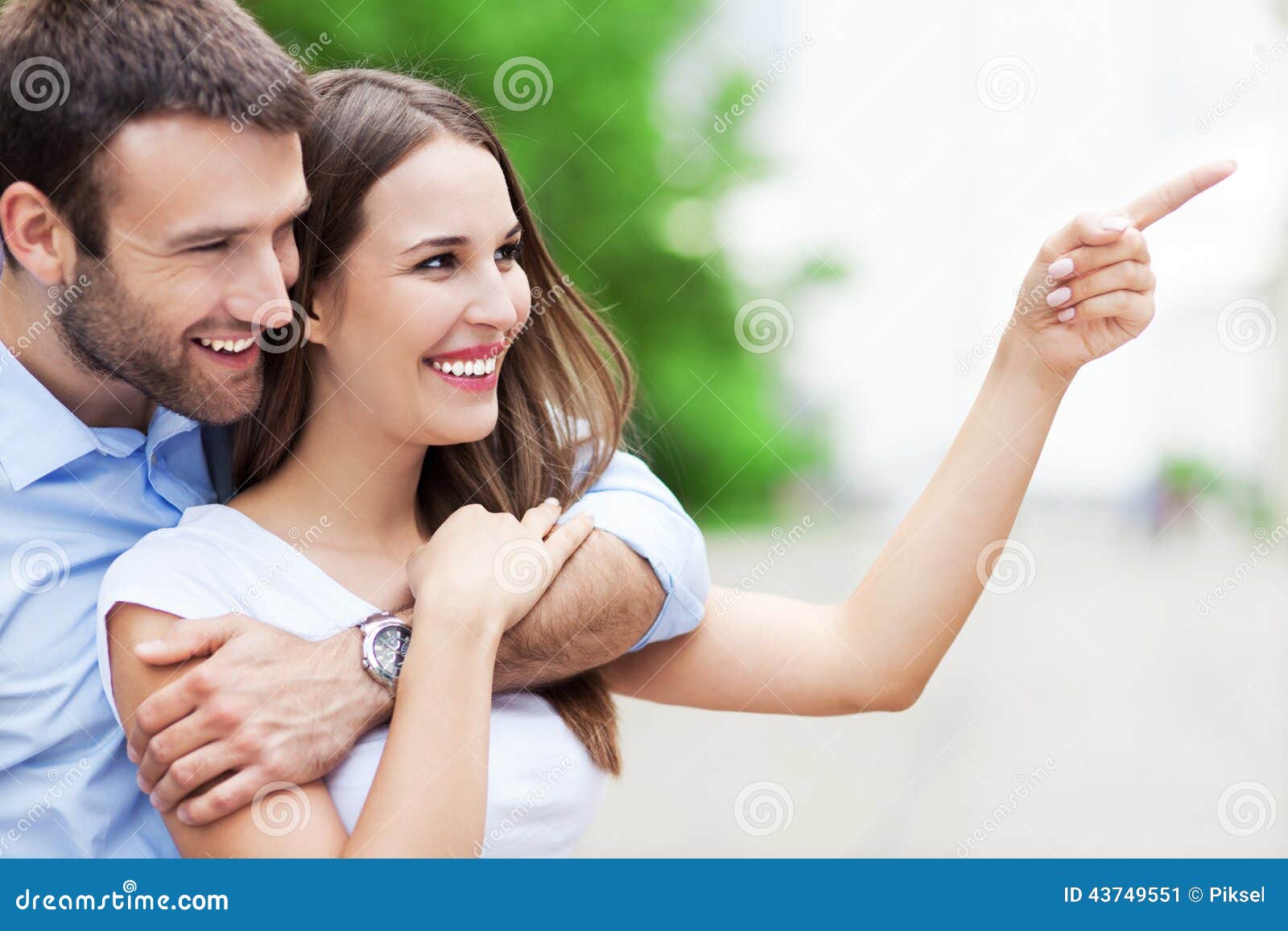 Happy Young Couple Pointing Finger Stock Image - Image of toothy ...