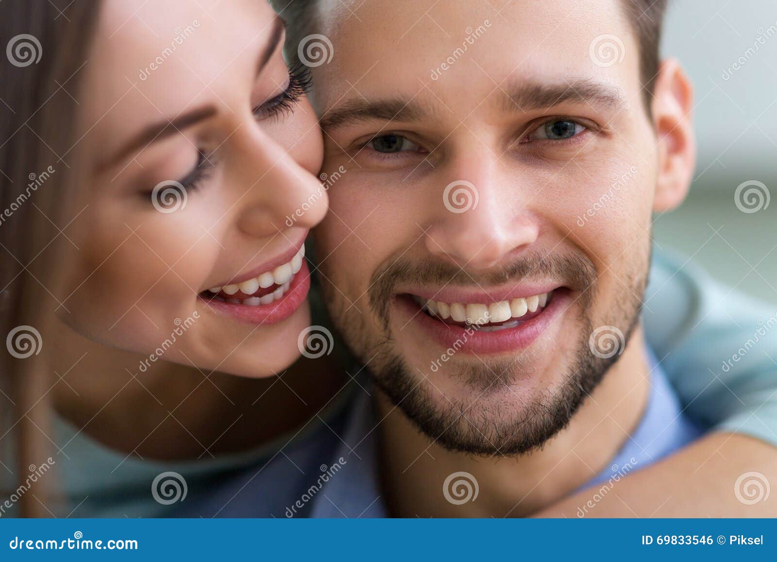 Happy young couple smiling stock photo. Image of love - 69833546