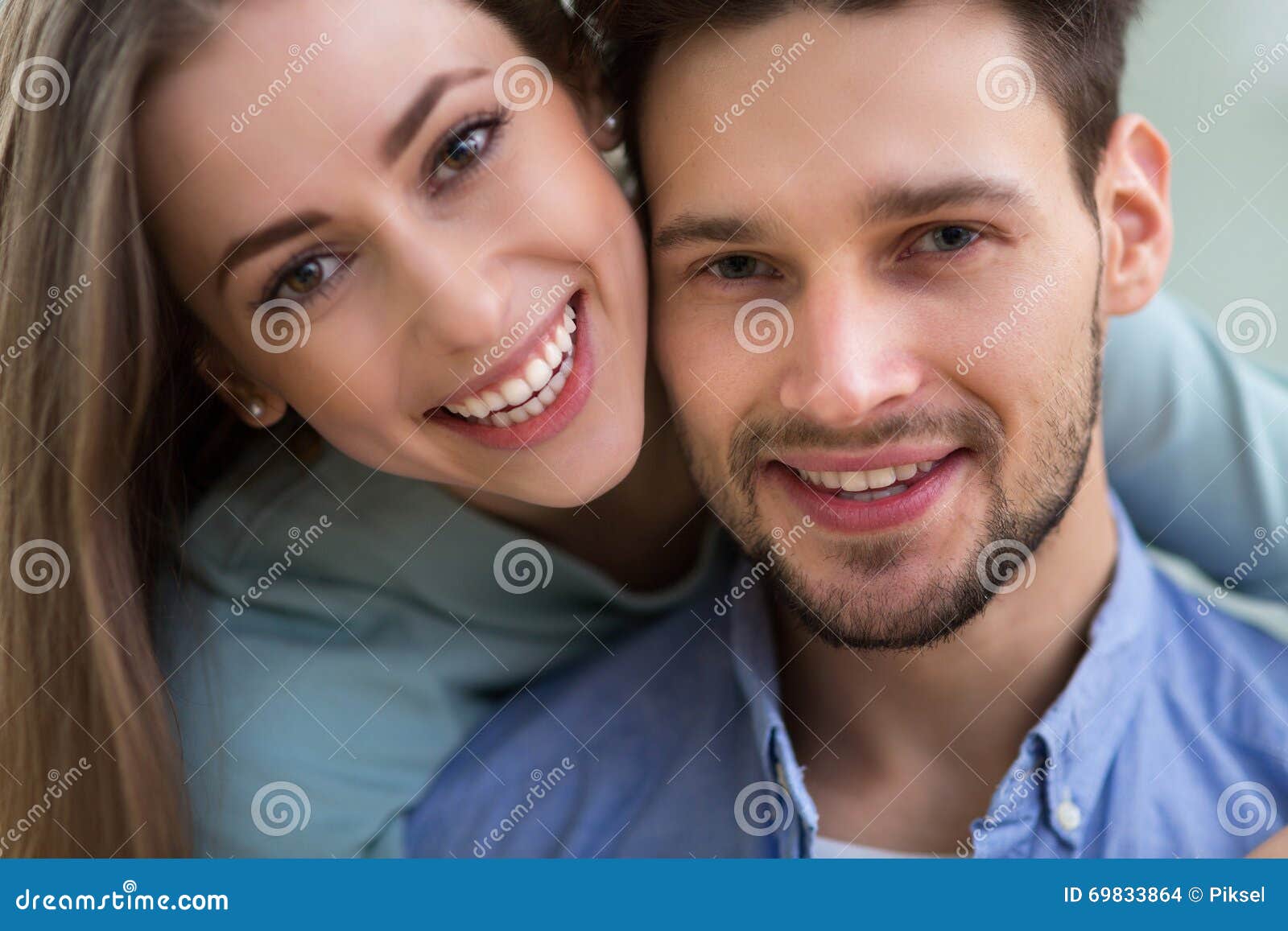 Happy young couple smiling stock photo. Image of boyfriend - 69833864