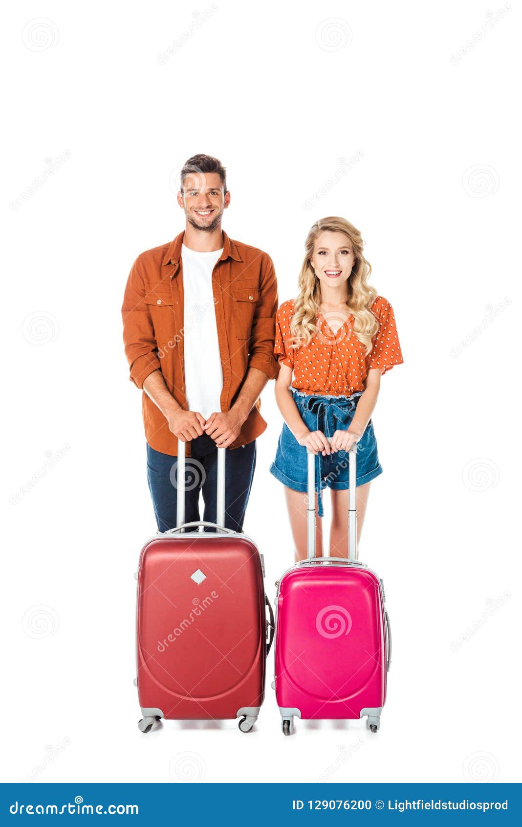 Happy Young Couple with Suitcases Looking at Camera Stock Photo - Image ...