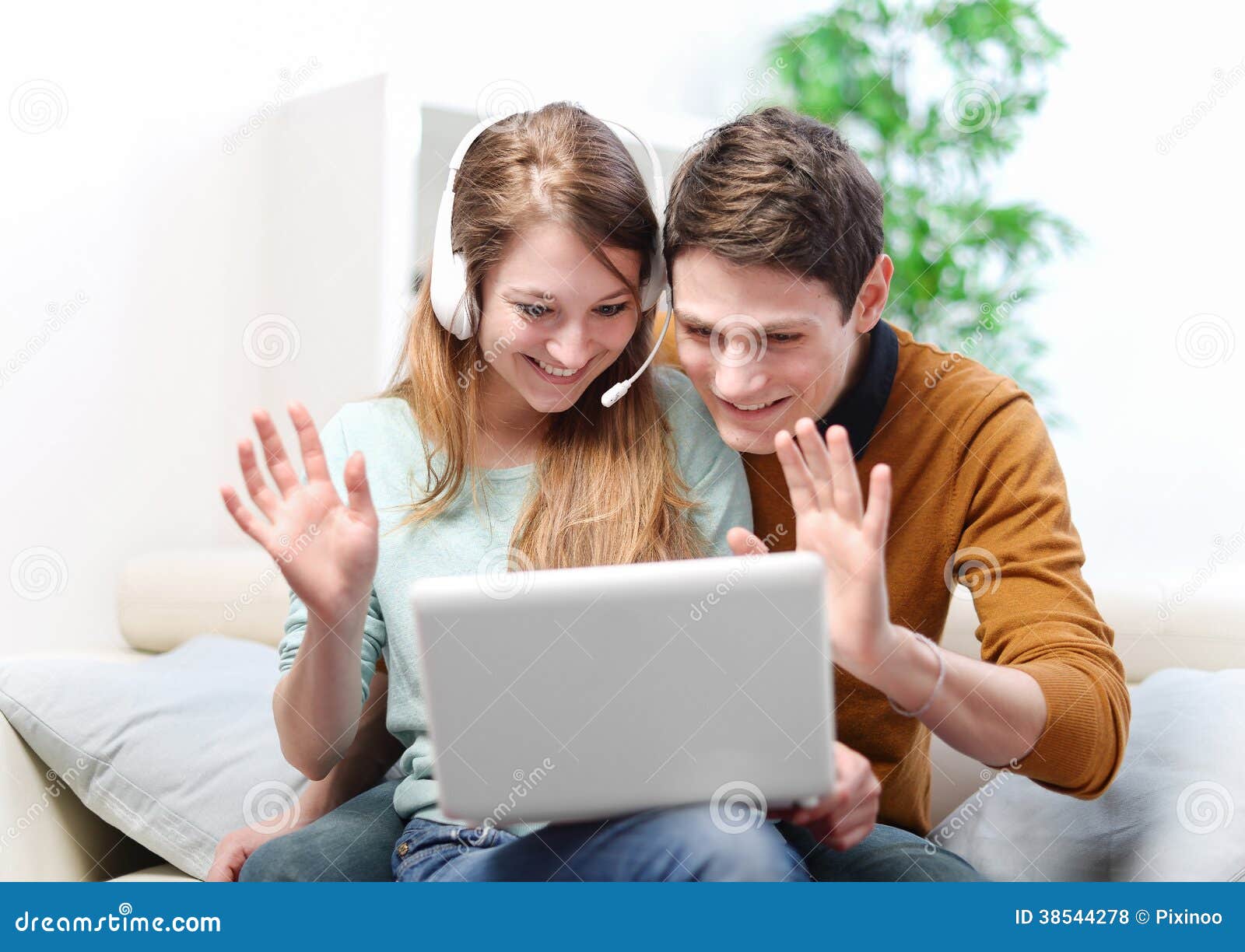 Happy Young Couple Talking through the Computer with Video Chat Stock ...