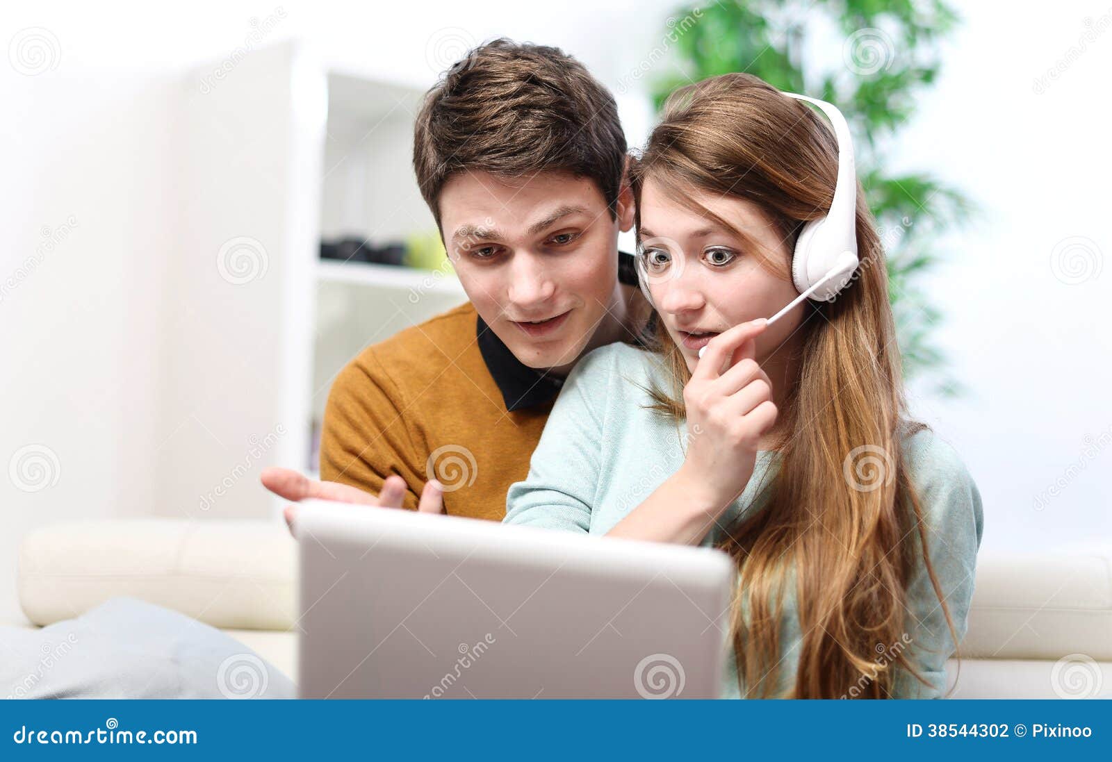 Happy Young Couple Talking through the Computer with Video Chat Stock ...