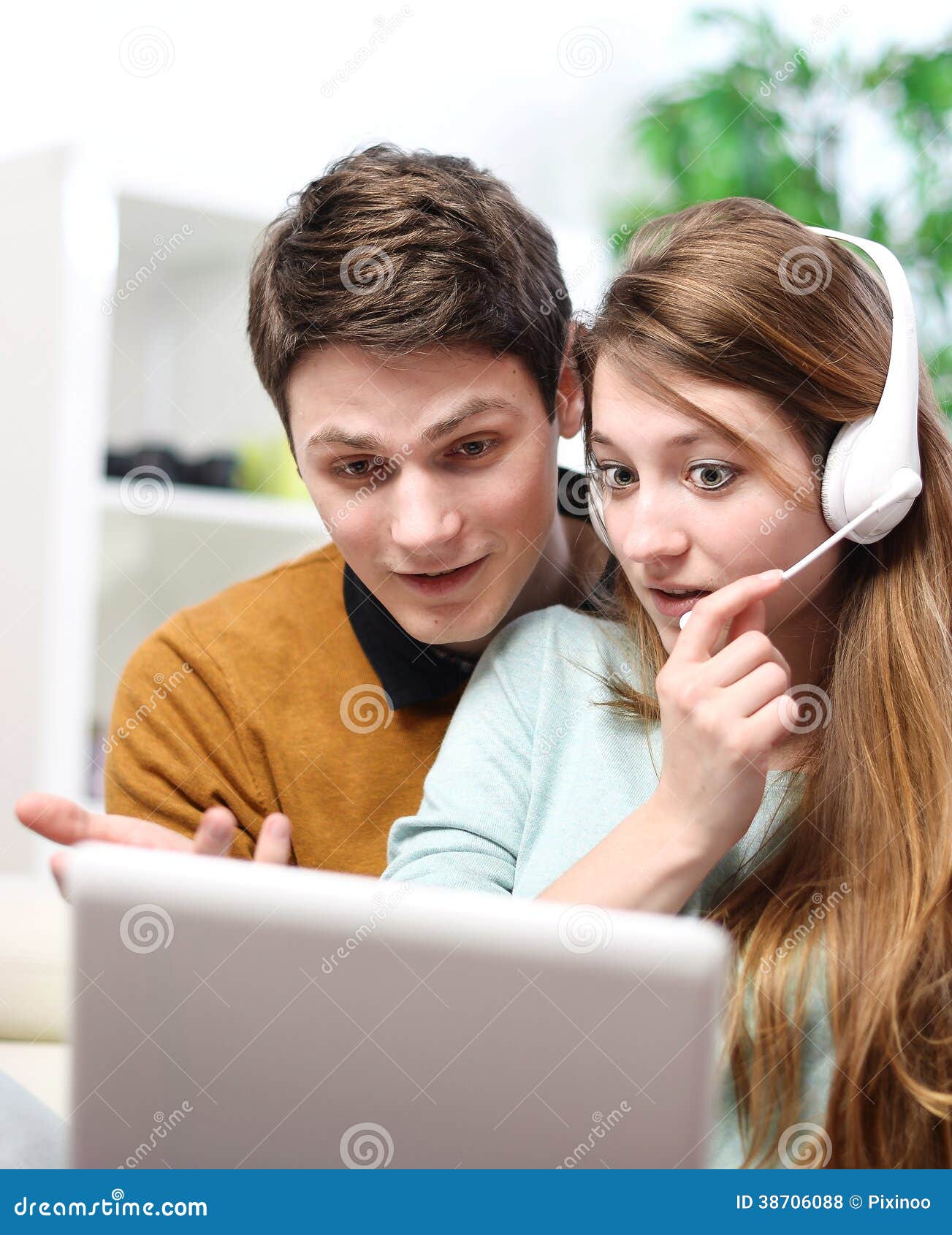 Happy Young Couple Talking through the Computer with Video Chat Stock ...