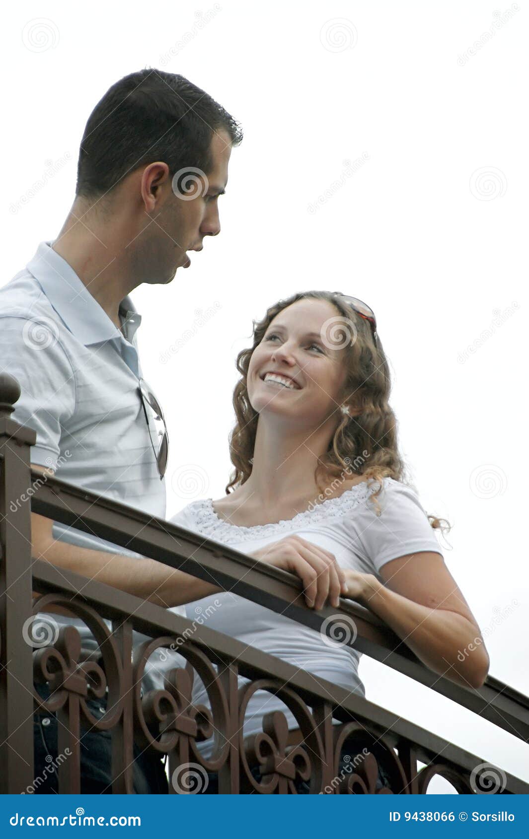 Happy Young Couple Talking on Outdoor Balcony Stock Photo - Image of ...