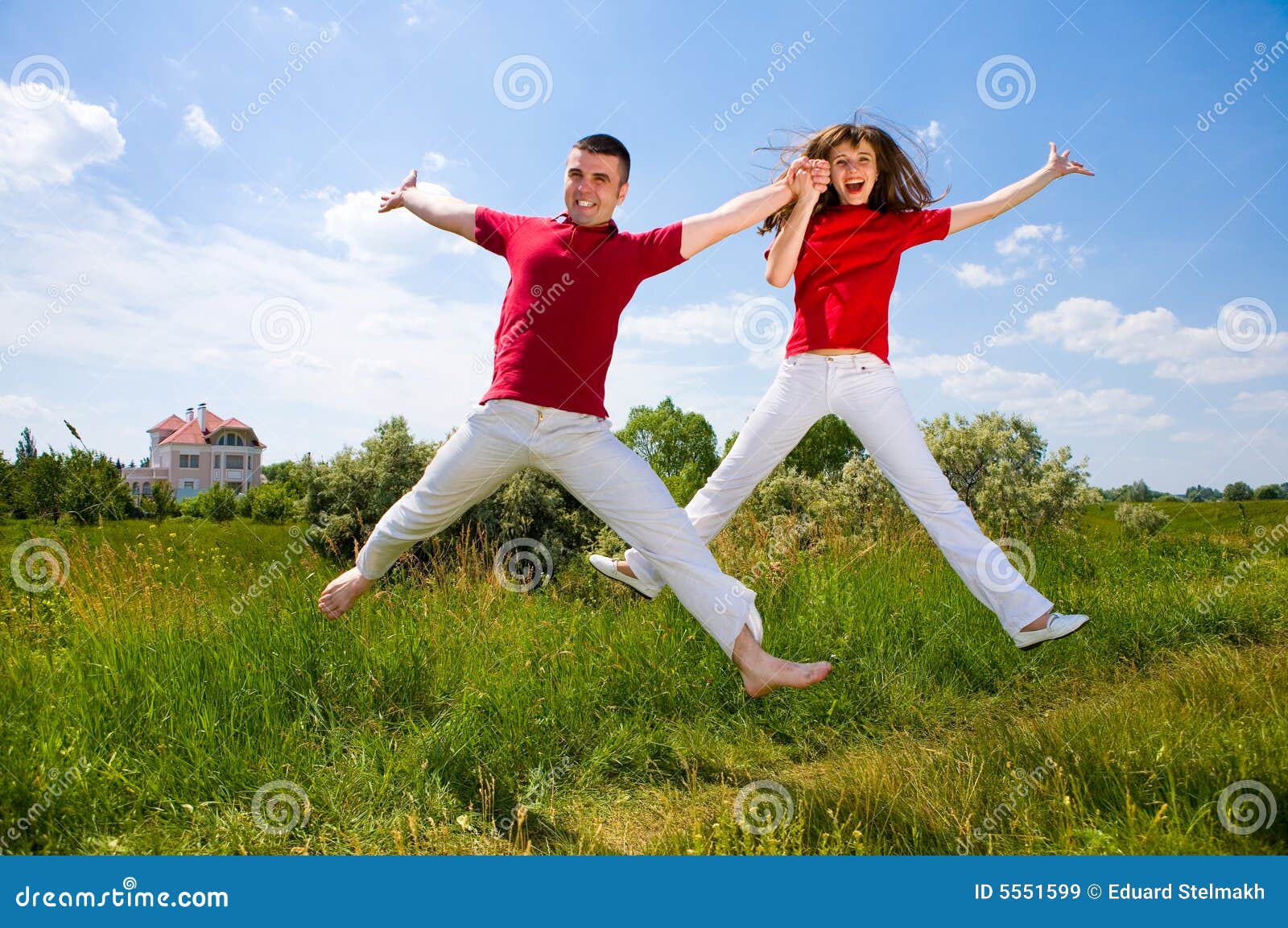 Happy Young Couple - Team is Jumping in the Sky Stock Image - Image of ...
