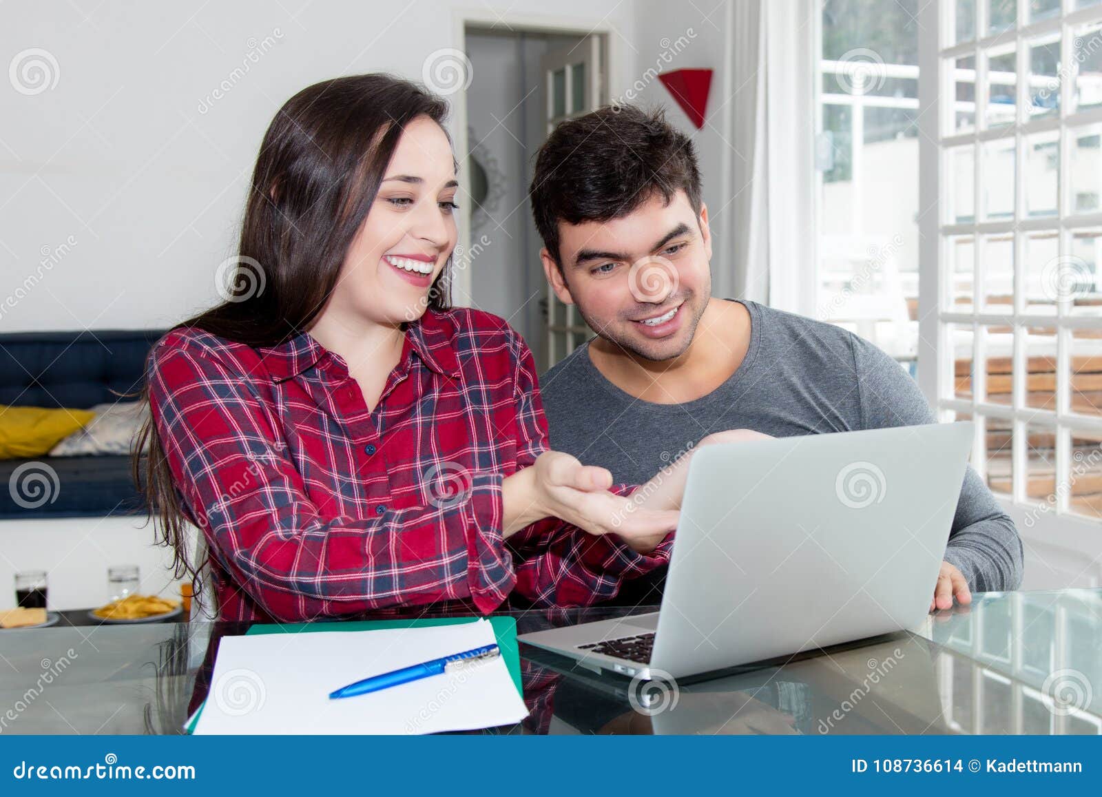 Happy Young Couple Using Computer at Home Stock Photo - Image of ...