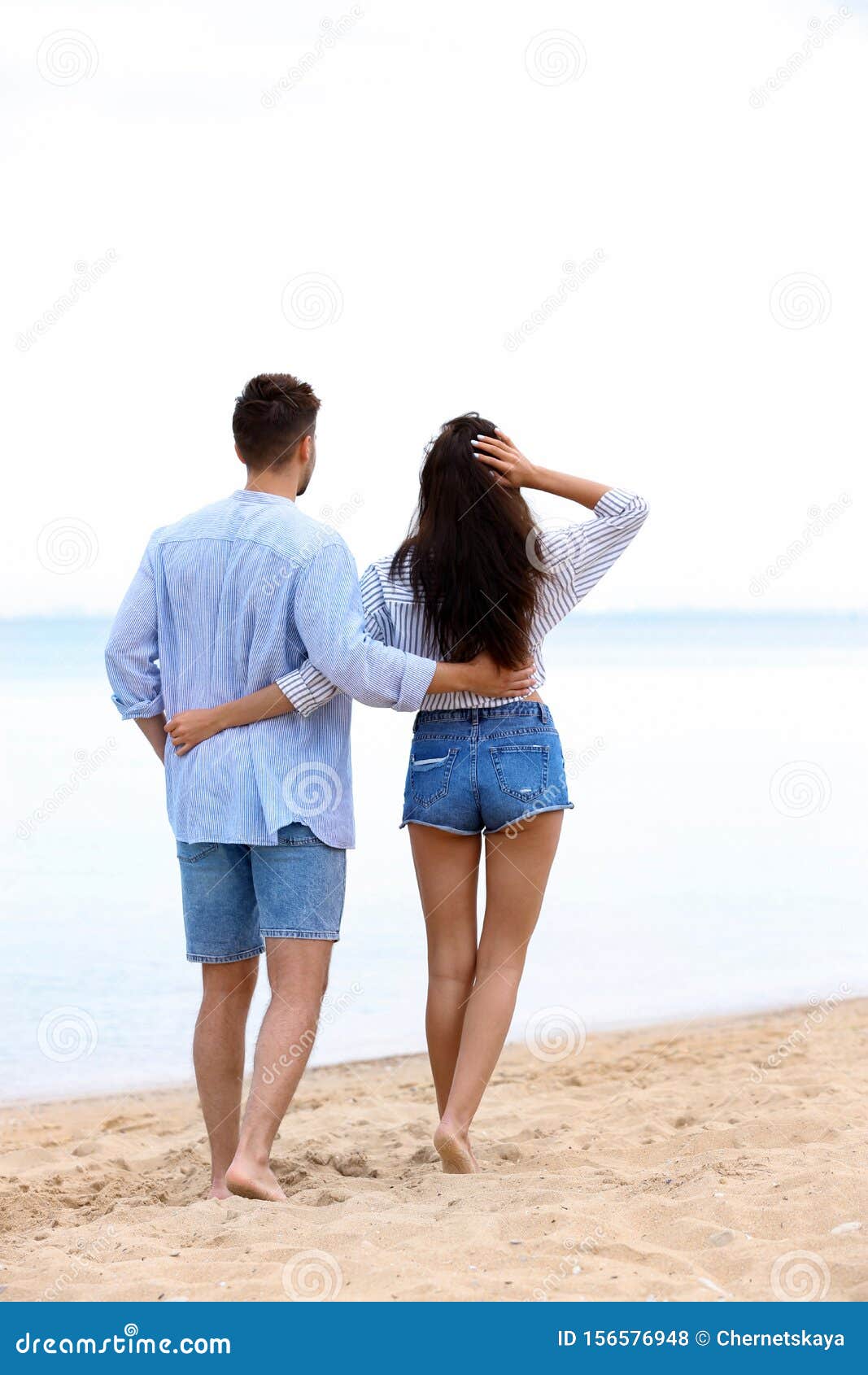 Happy Young Couple Walking Together on Beach Stock Photo - Image of ... Happy Young Couple Walking Together on Beach Stock Photo - Image of ...