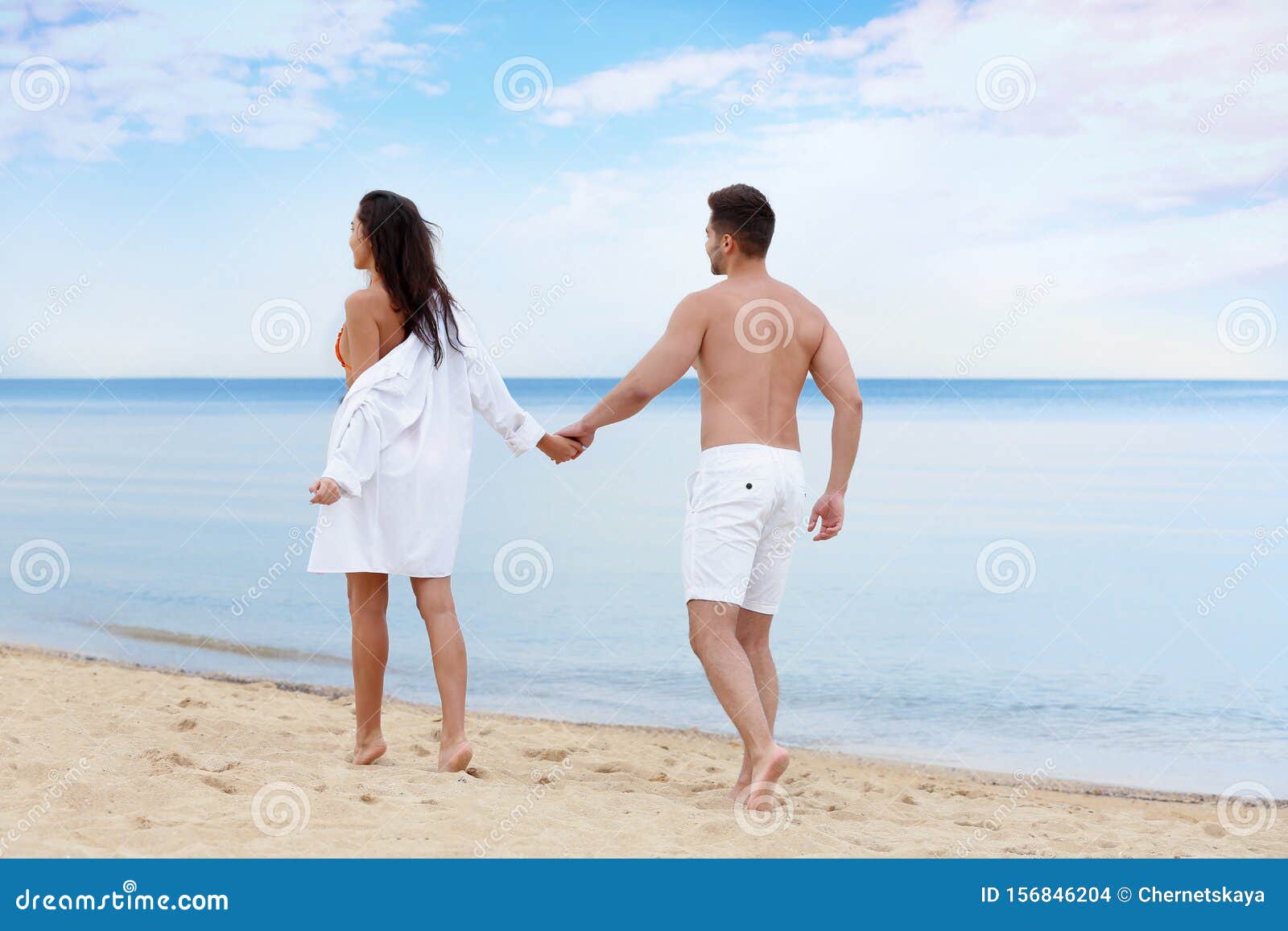 Happy Young Couple Walking Together on Beach Stock Photo - Image of ... Happy Young Couple Walking Together on Beach Stock Photo - Image of ...