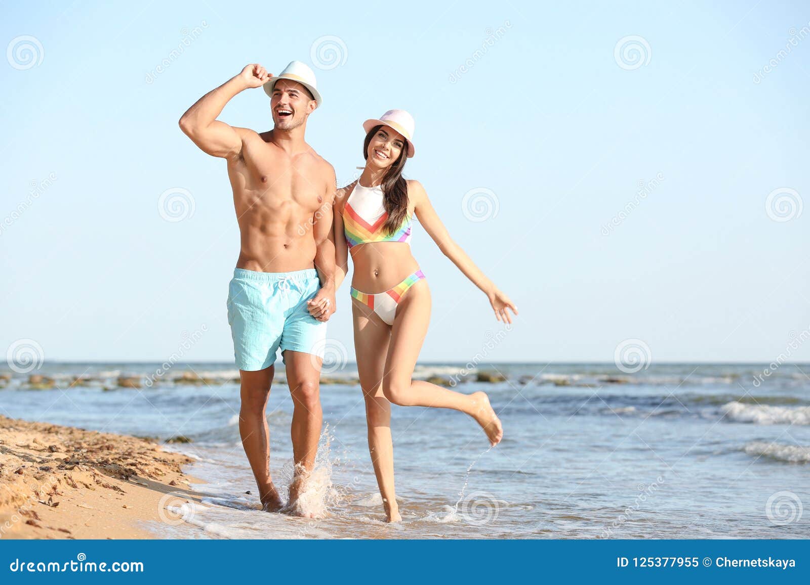 Happy Young Couple Walking Together Stock Image - Image of resort ... Happy Young Couple Walking Together Stock Image - Image of resort ...