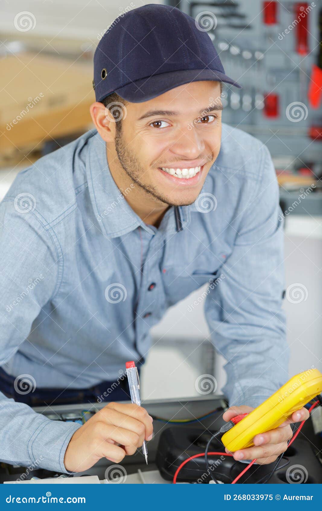 Happy Young Electrician at Work Measures Stock Image - Image of ...