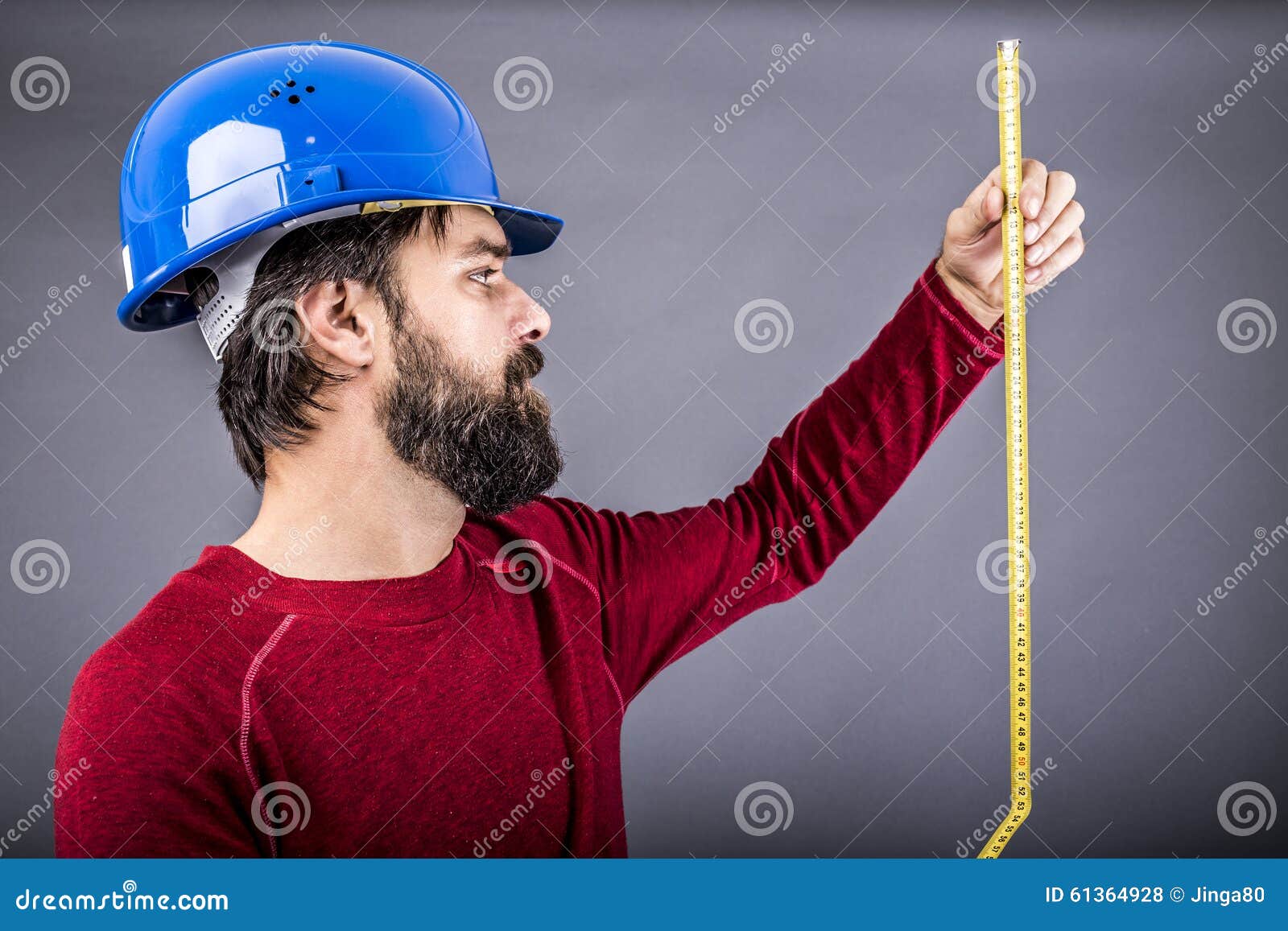 Happy Young Engineer with Hardhat Holding a Measuring Tape Stock Photo ...