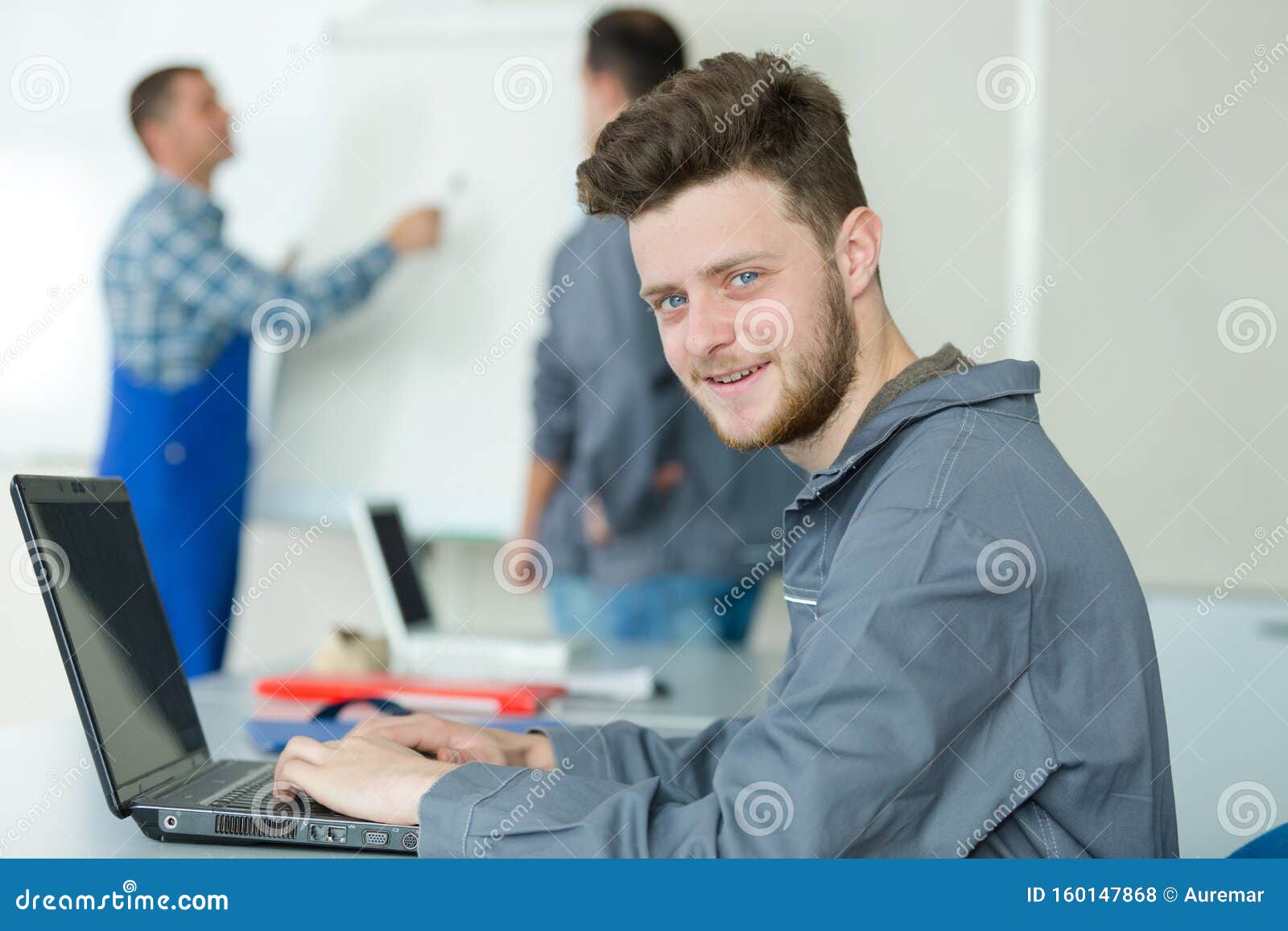 Happy Young Engineer with Laptop Testing Stock Photo - Image of ...