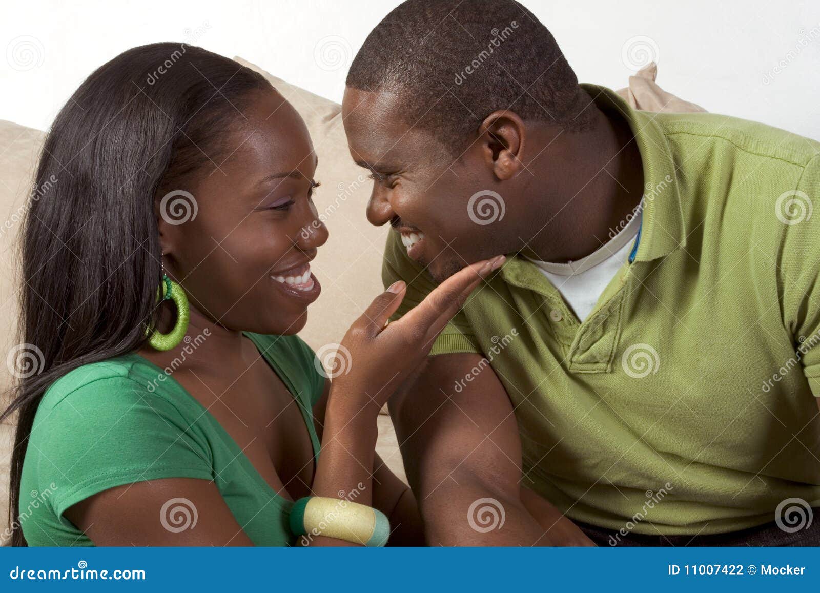 Happy Young Ethnic Black Couple Sitting on Couch Stock Photo - Image of ...