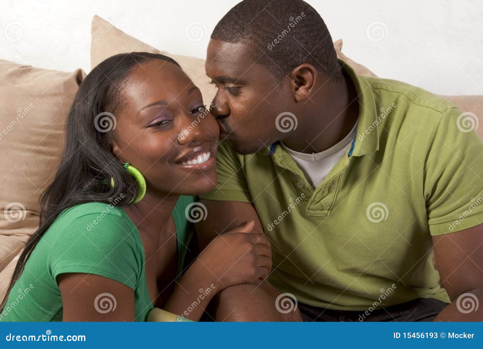 Happy Young Ethnic Black Couple Sitting on Couch Stock Image - Image of ...