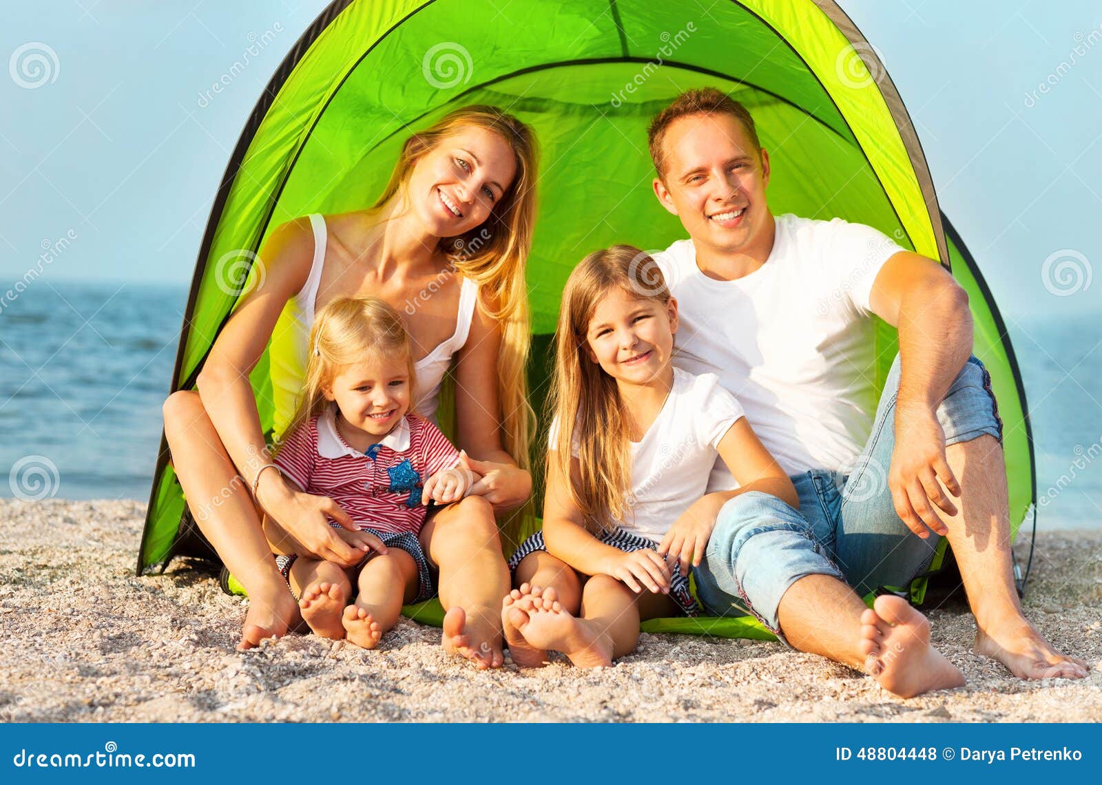 Happy Young Family Camping on the Beach Stock Photo - Image of guitar ...